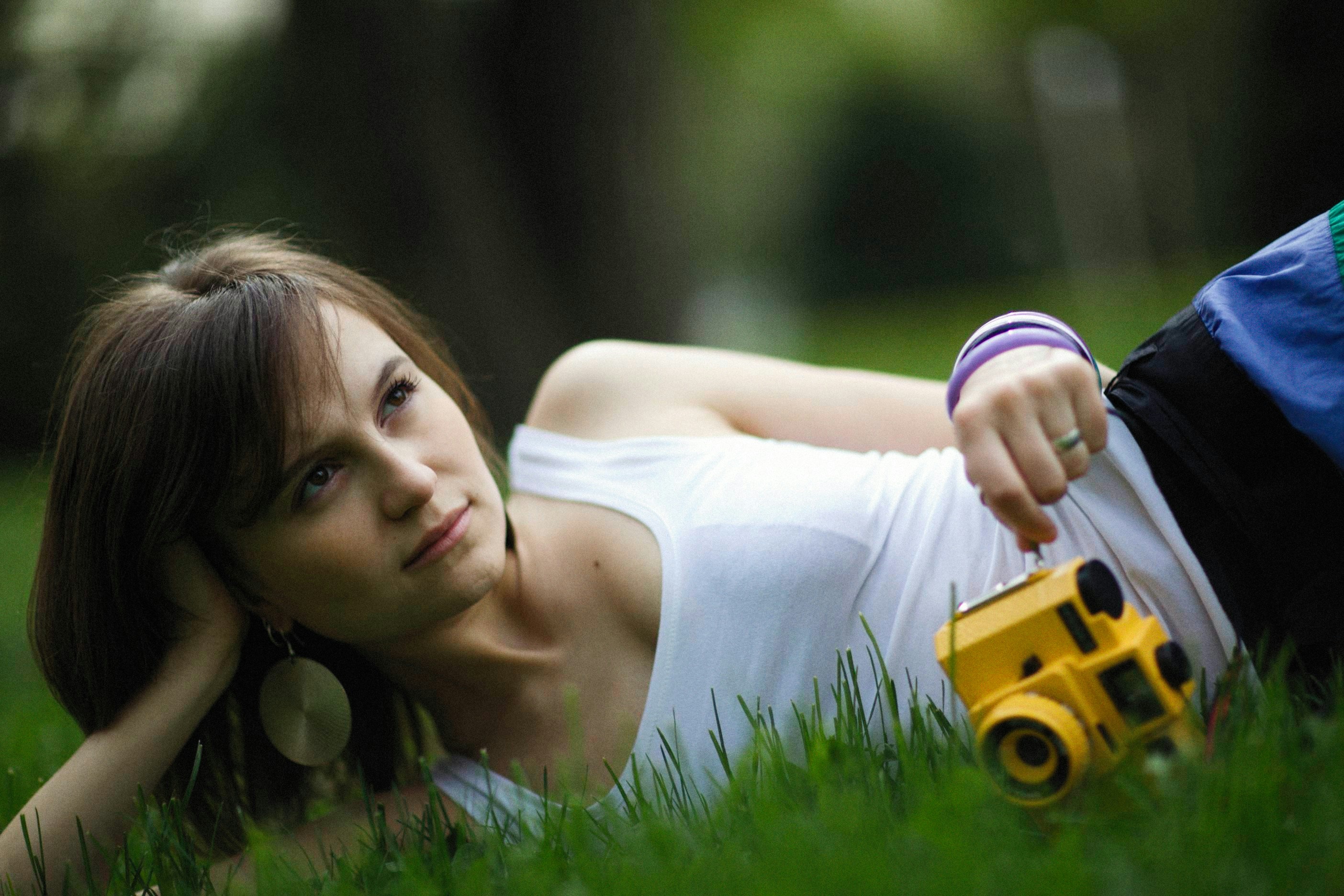 Relaxed Portrait in the Grass with a Toy Truck