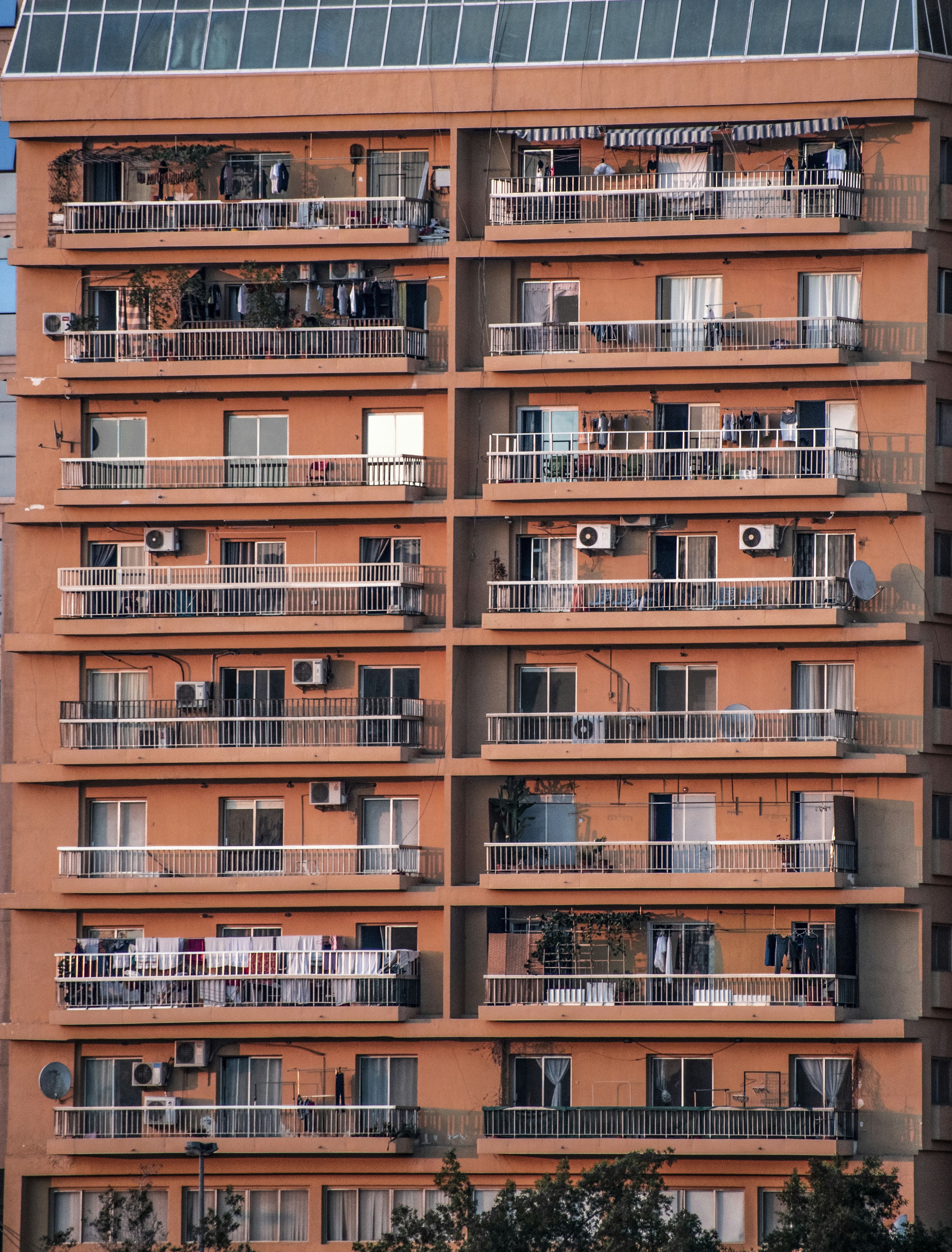 A tall building with balconies and balconies on the balconies photo ...