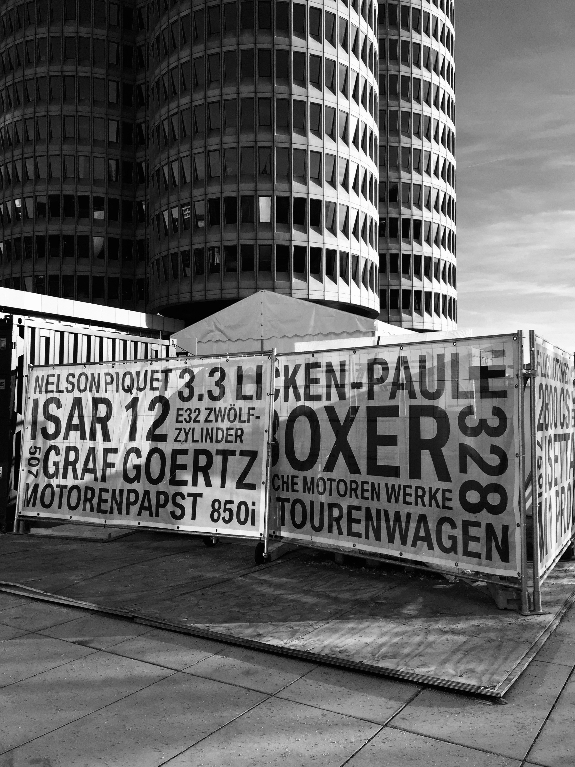 a black and white photo of a street sign