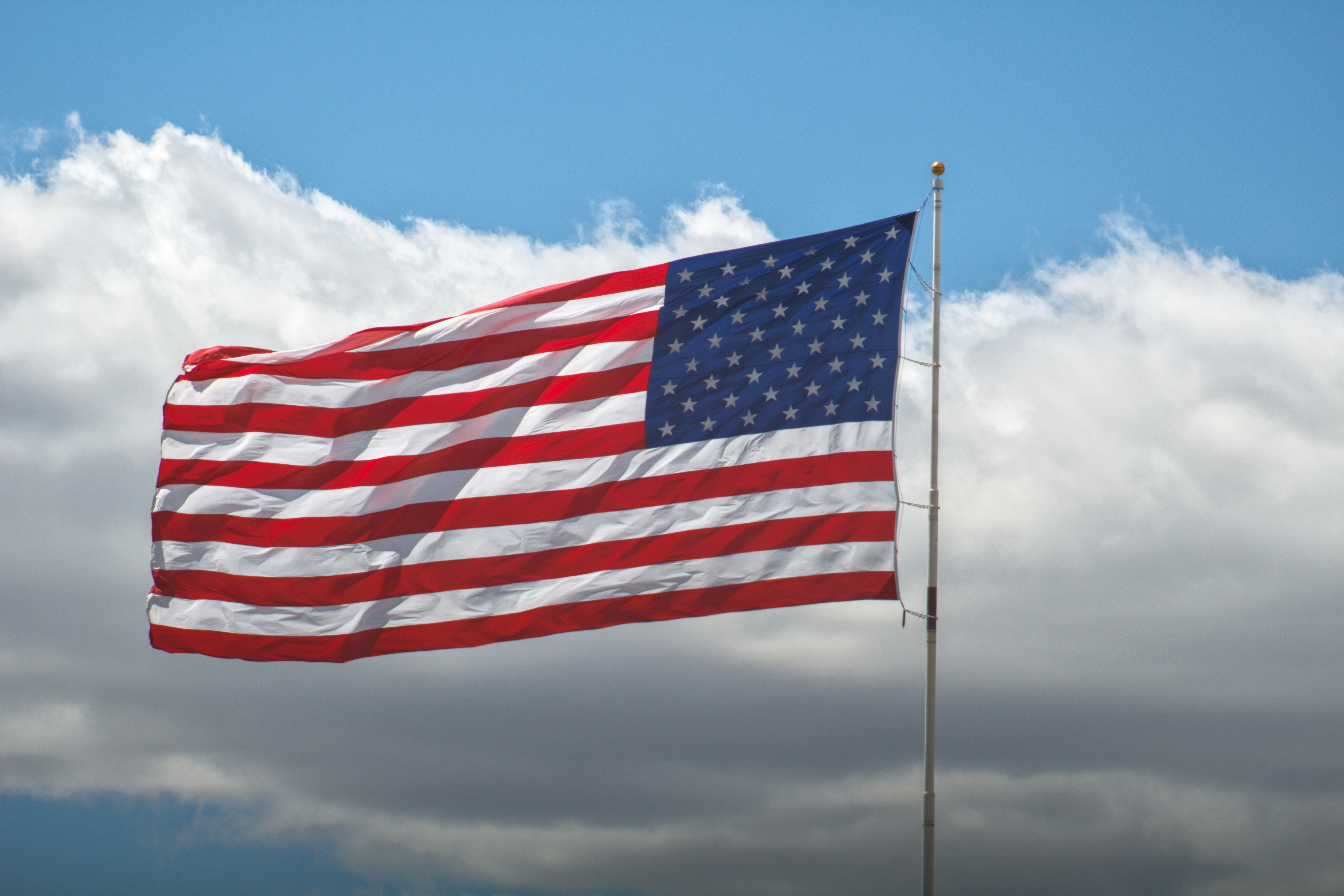 A large american flag flying in the sky photo – Free Symbol Image on ...