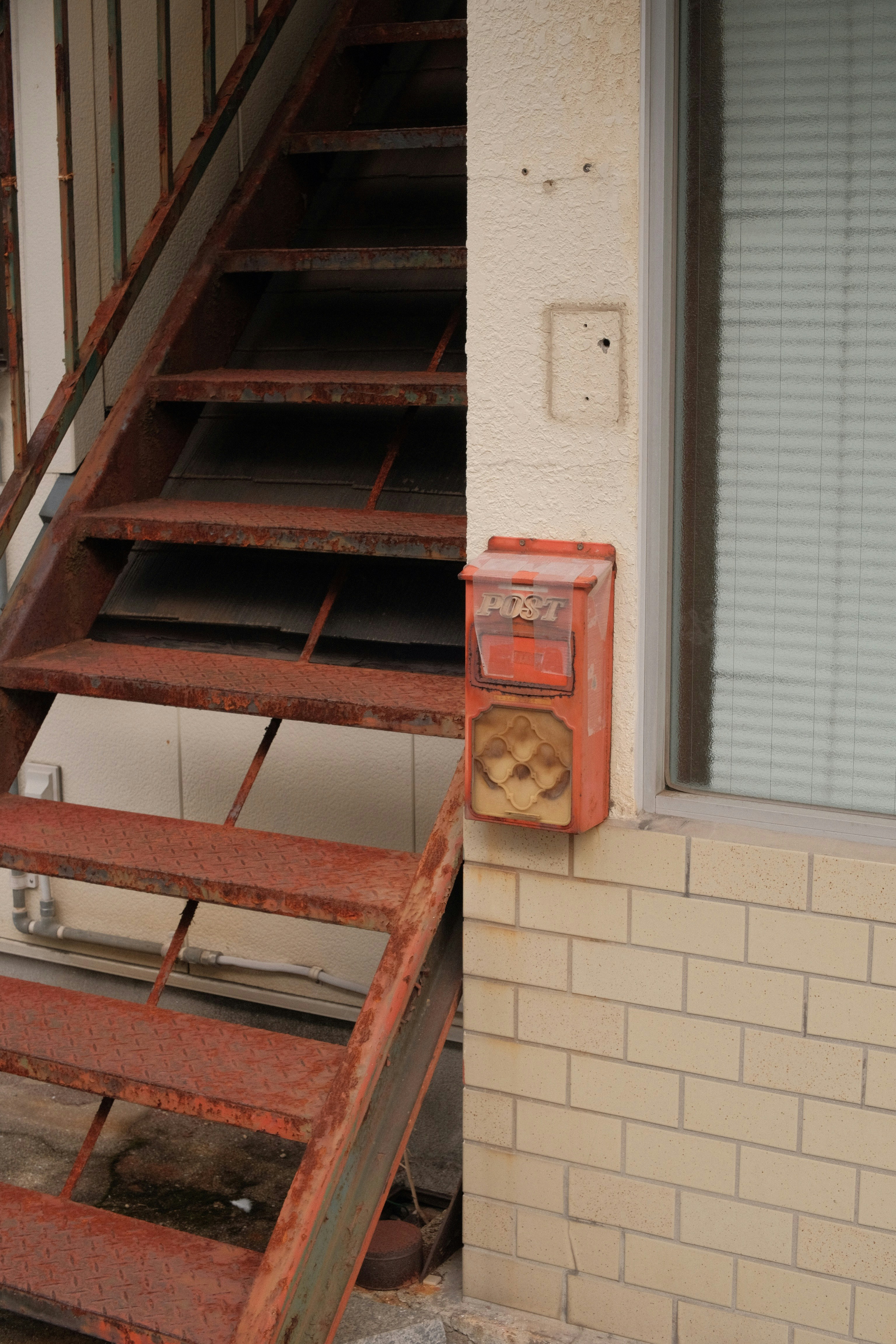 A fire hydrant sitting next to a set of stairs photo – Free Banister ...