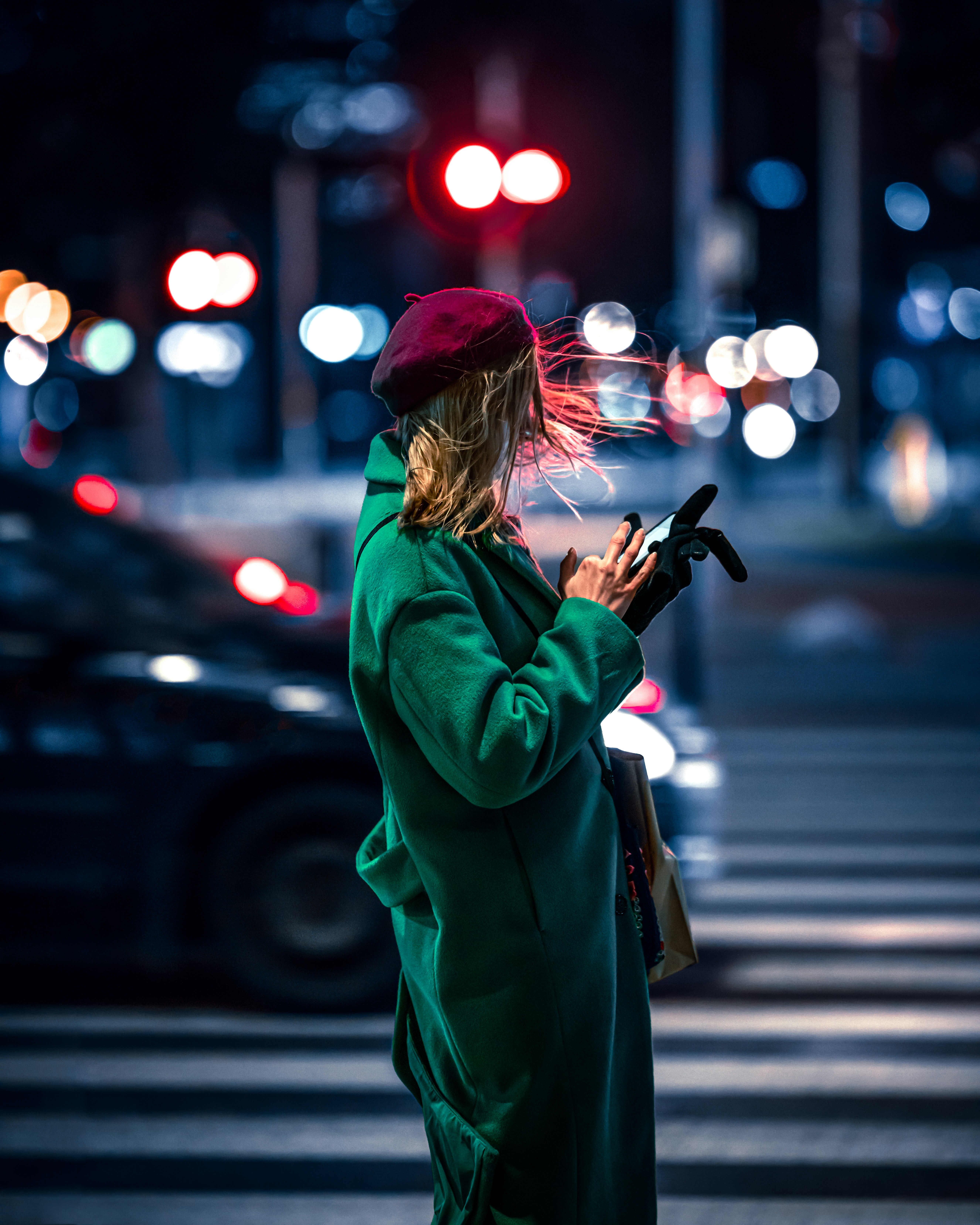 Emerald Overcoat Under Neon Rain: A Night Walk at the Crosswalk