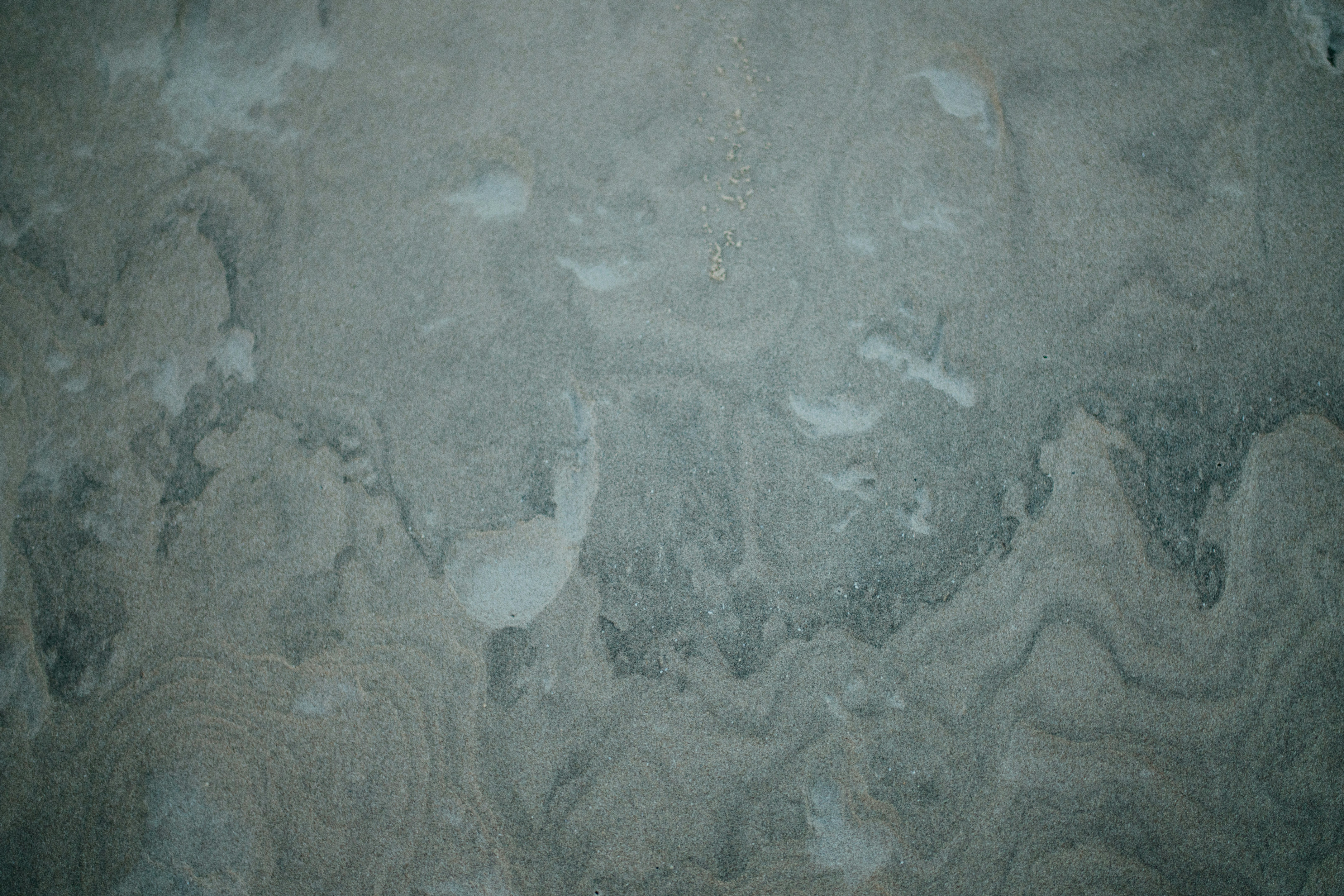 a close up of a textured surface of sand