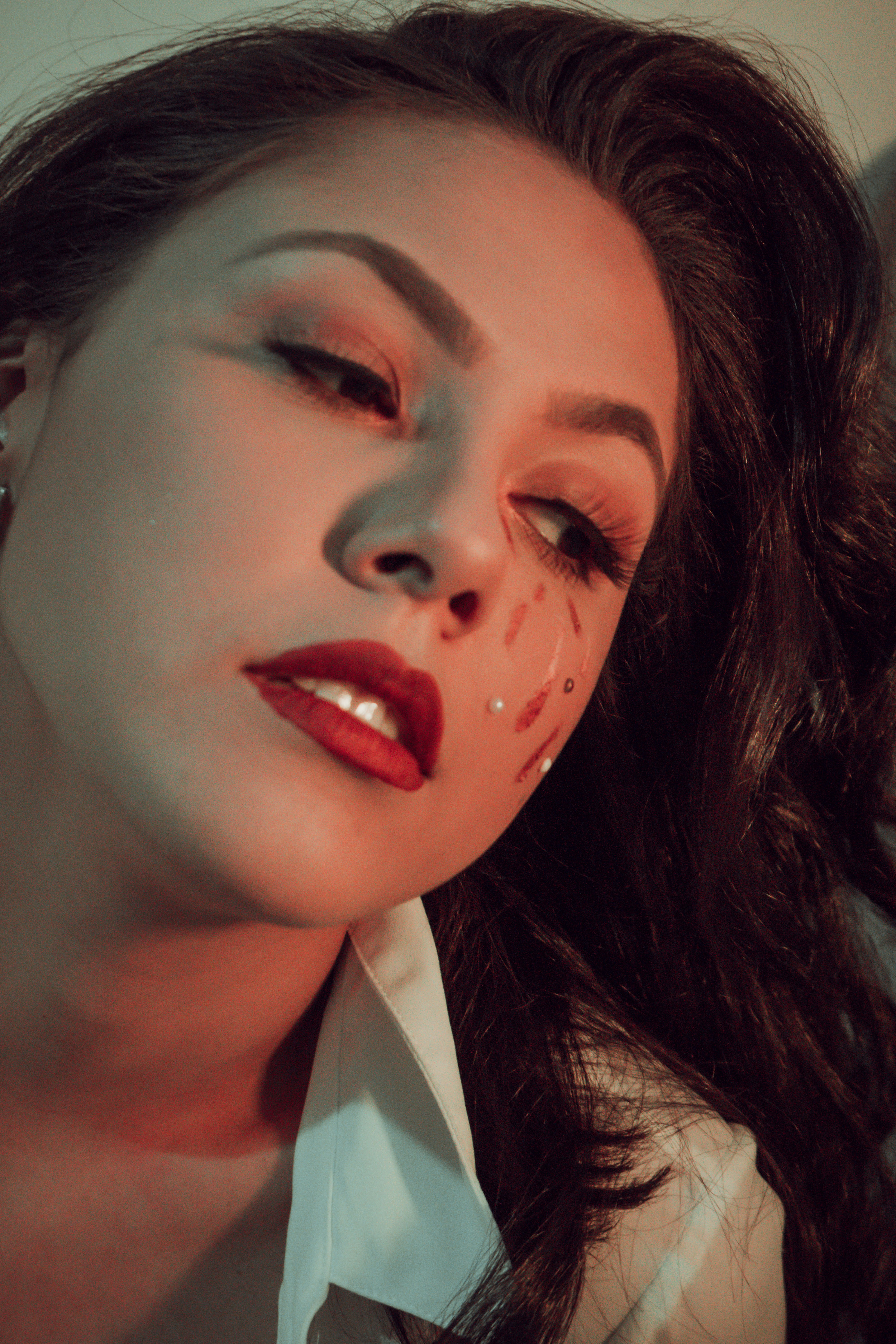 A woman with blood on her face and nose photo – Free Artistic portrait ...