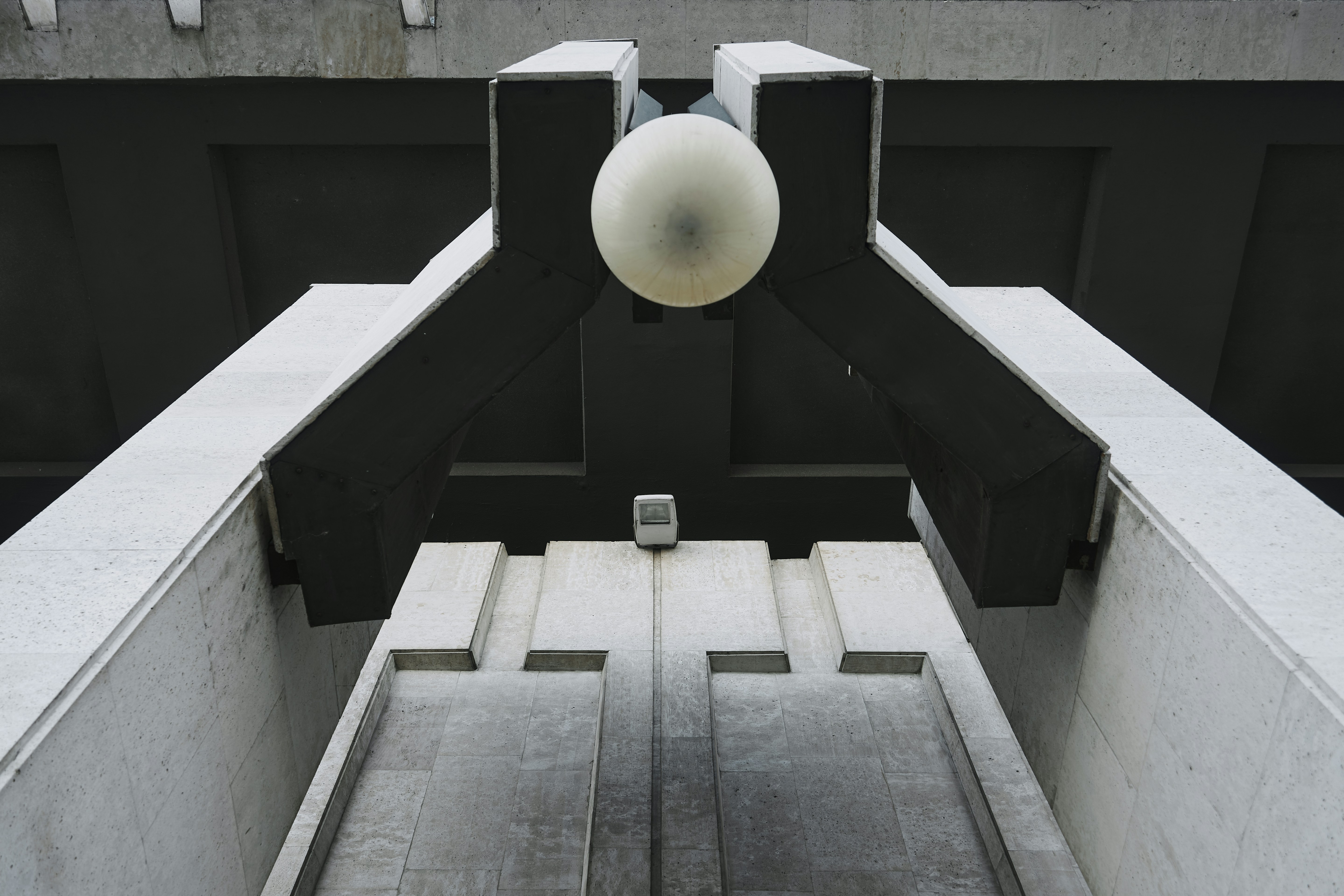 Center of Gravity: A Concrete Convergence Beneath a Spherical Beacon