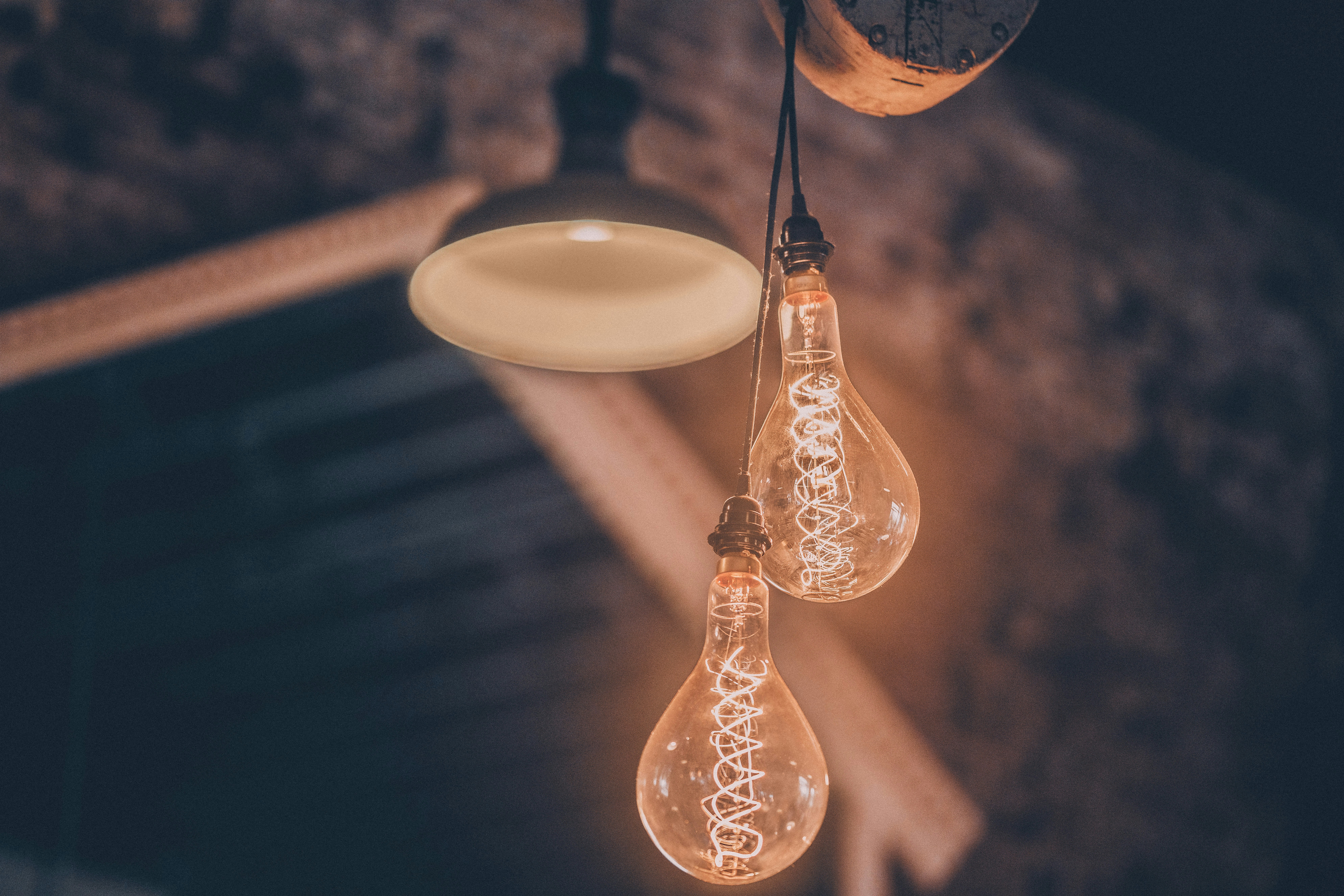 A couple of light bulbs hanging from a ceiling photo – Free Grey Image ...