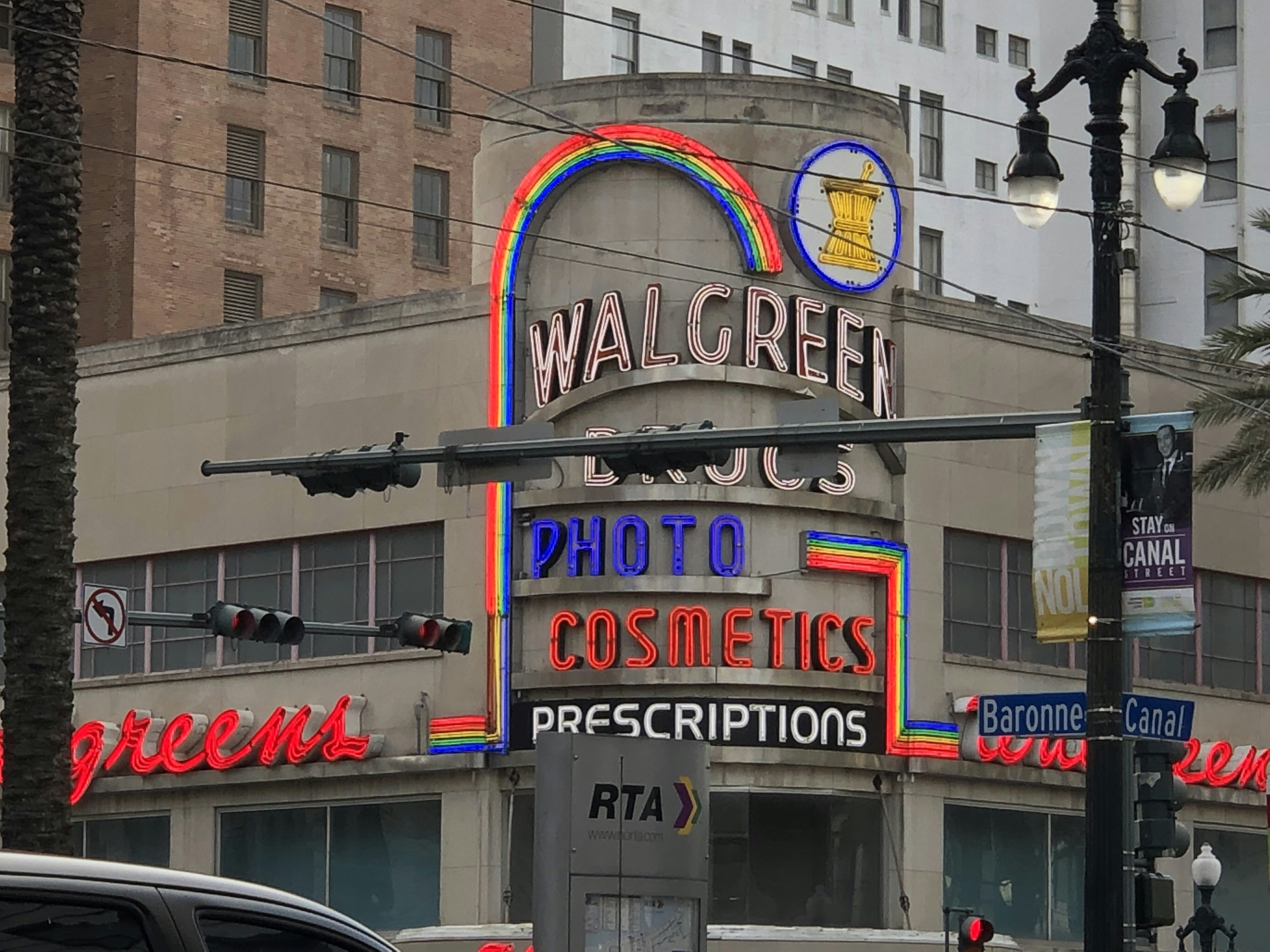 Rainbow Arch Over Walgreens: Neon Signage on a City Street