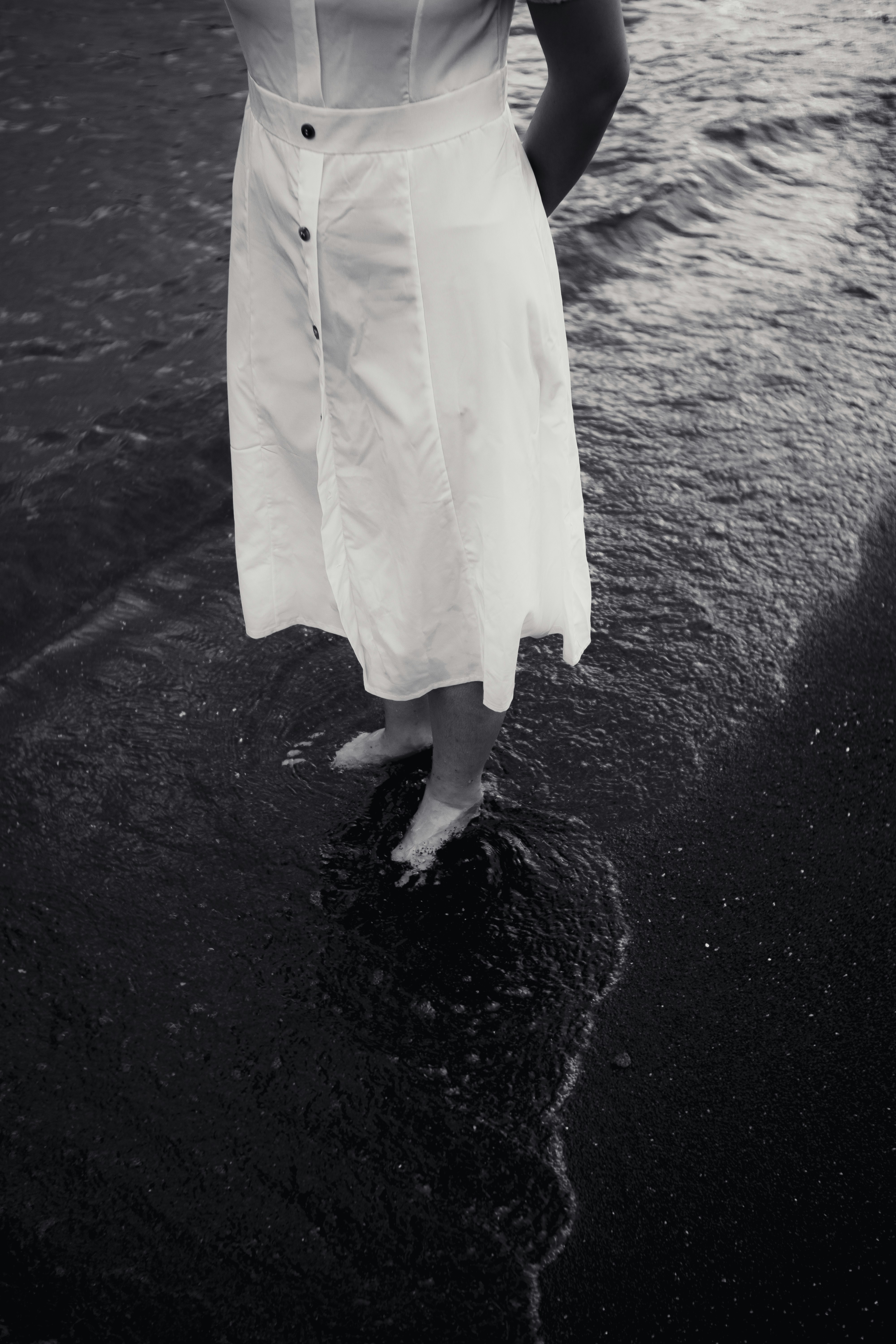 Edge of the Tide: A White Dress in Dark Water