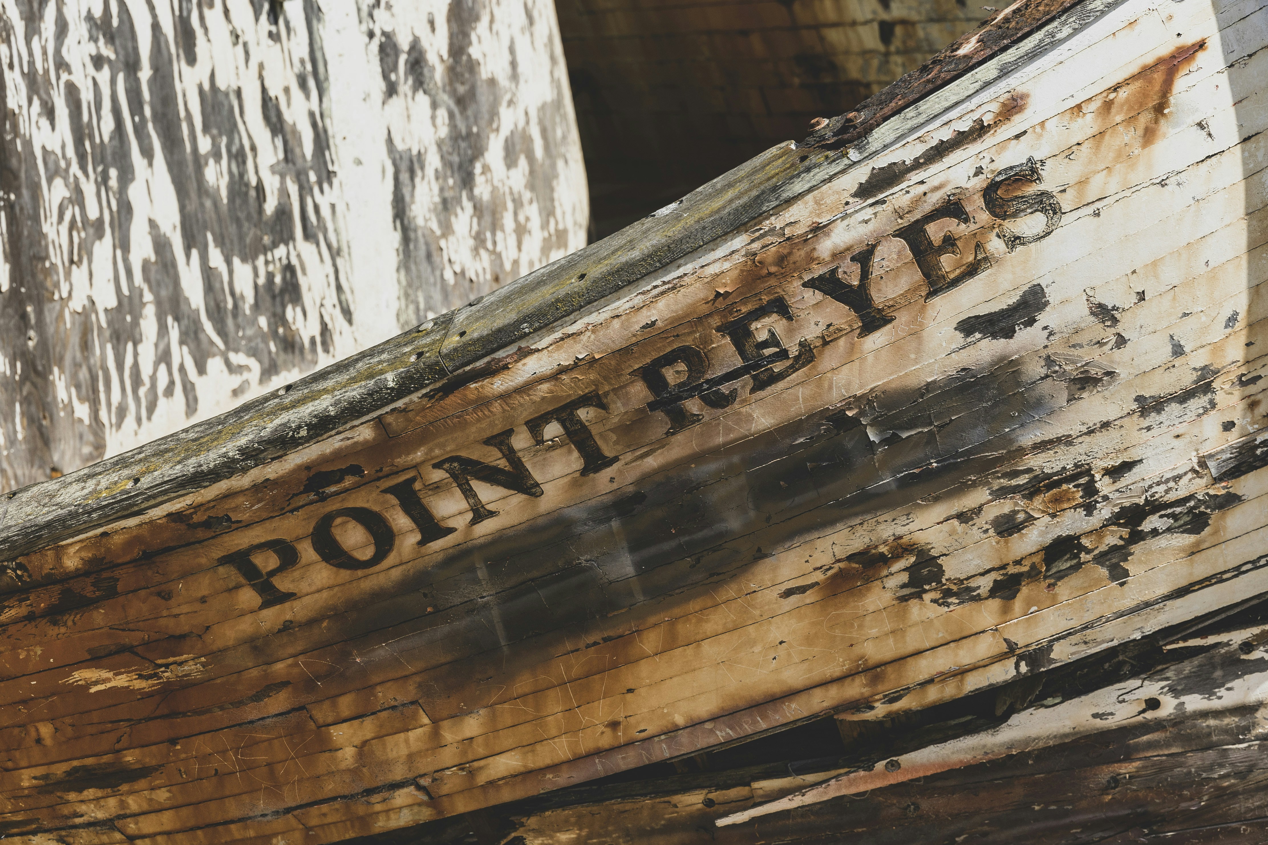 Point Reyes on a Weathered Hull: Weathered Wood and Bold Lettering