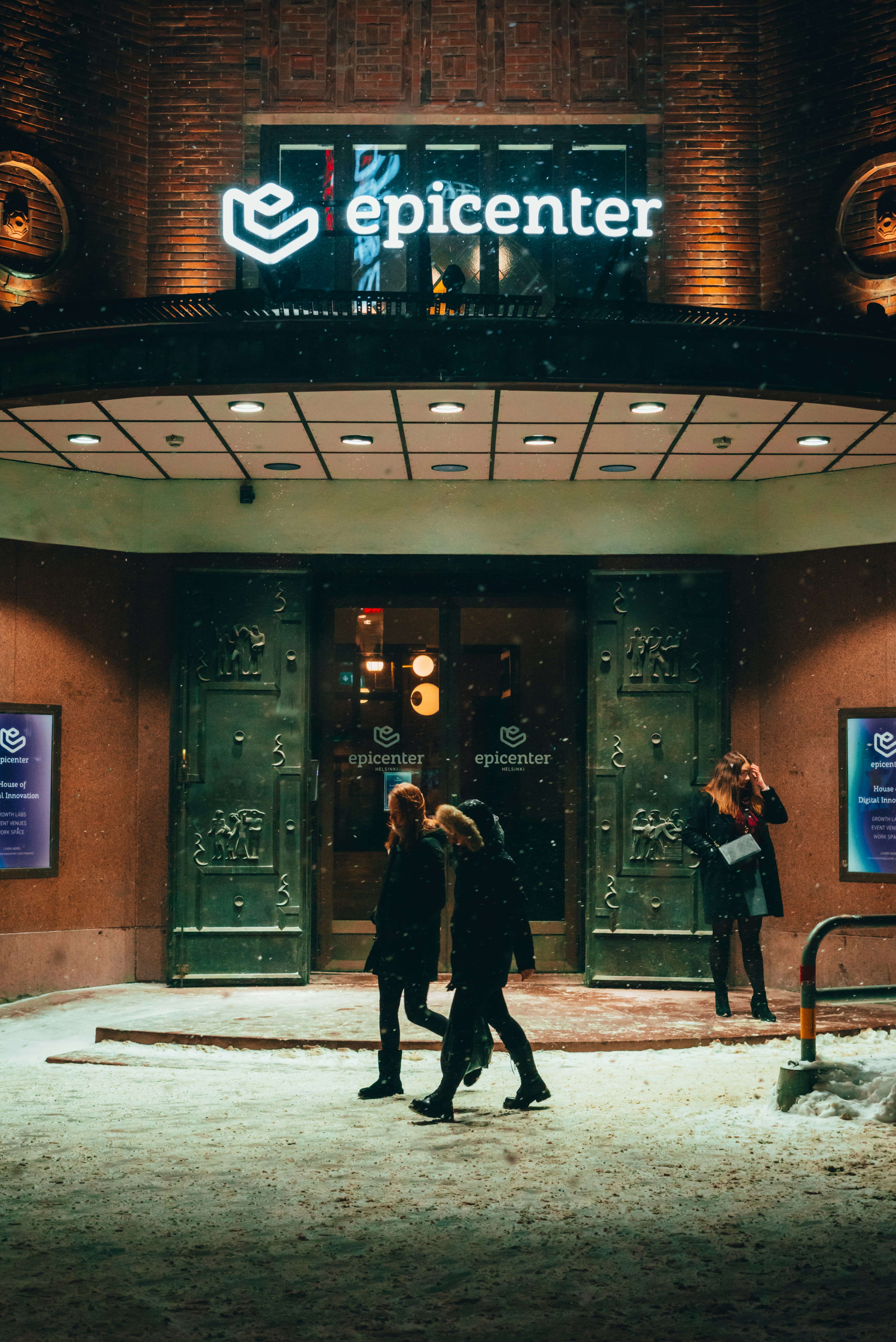 A group of people standing outside of a building photo – Free Helsinki ...