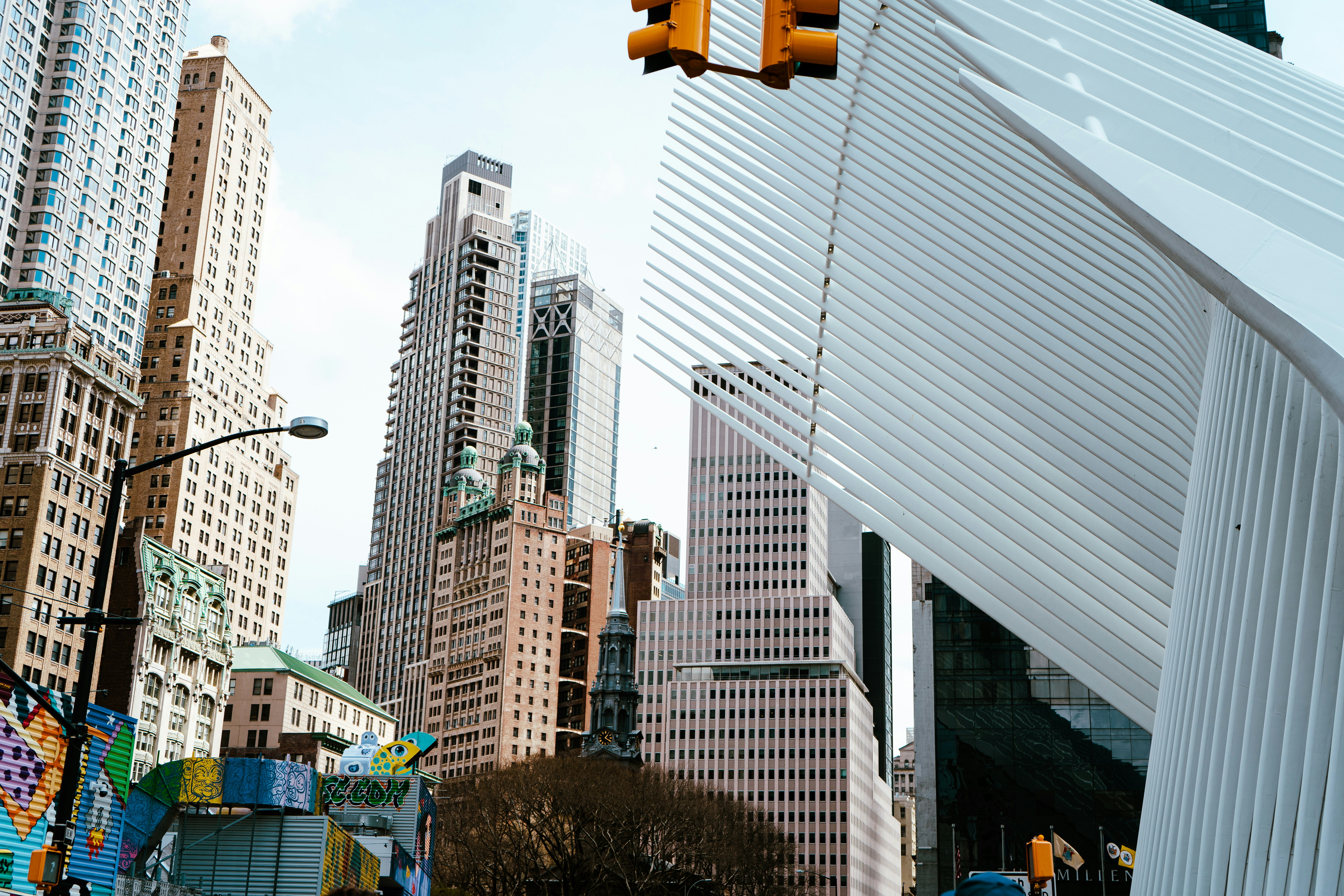 a traffic light hanging over a street next to tall buildings