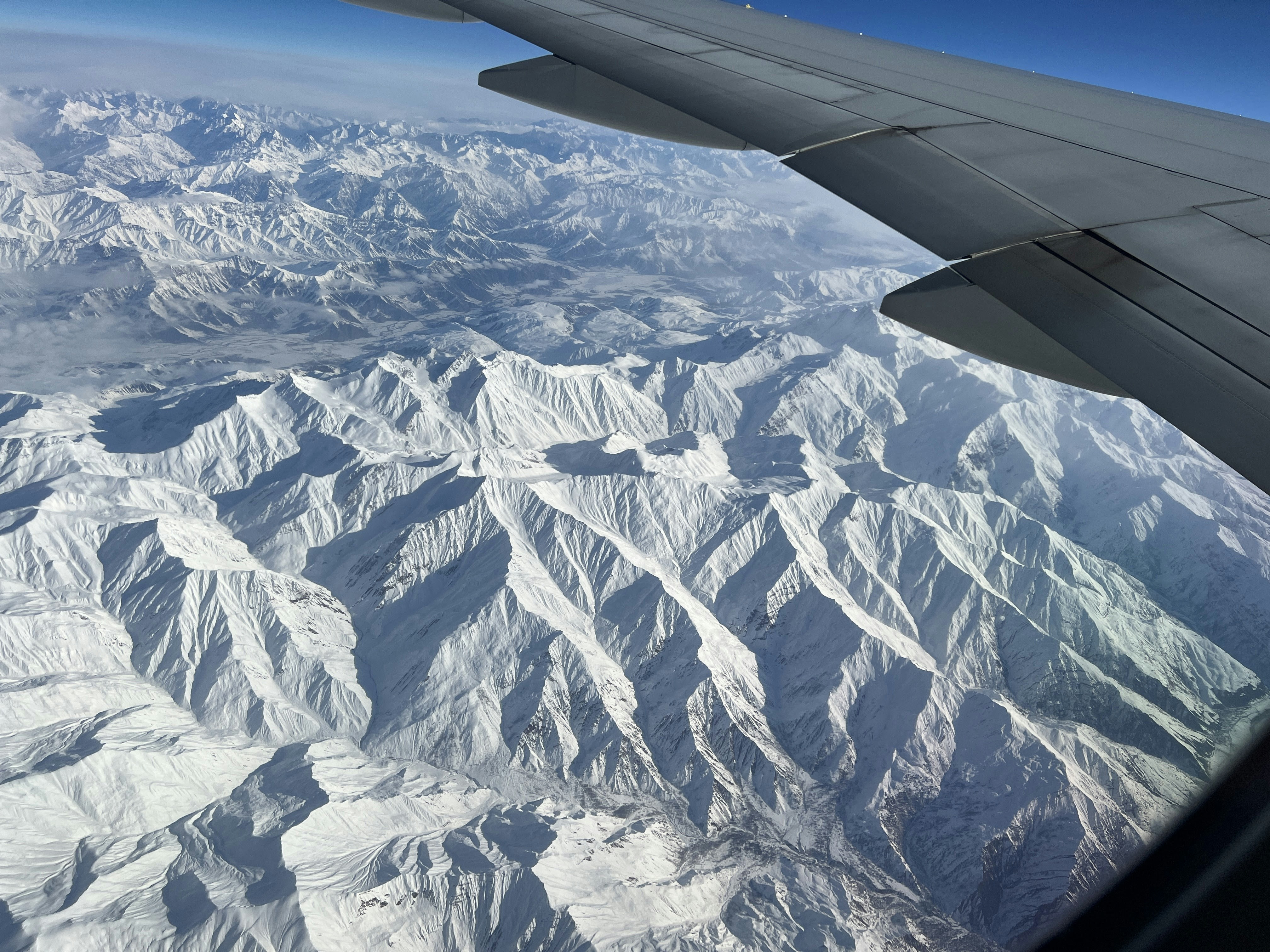 Wing-View Over a Sea of Alpine Ridges