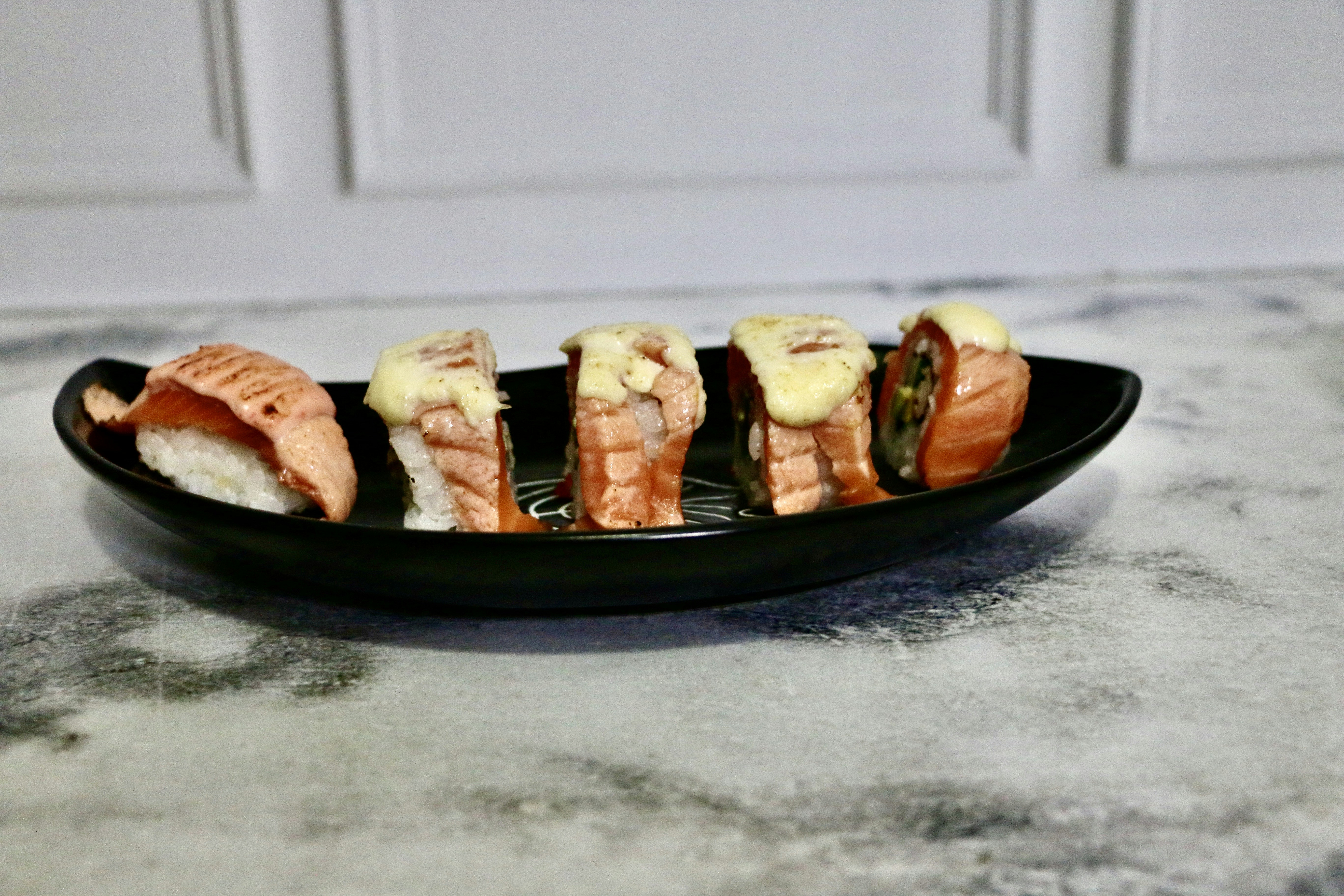 A plate of sushi on a marble table photo – Free Food Image on Unsplash