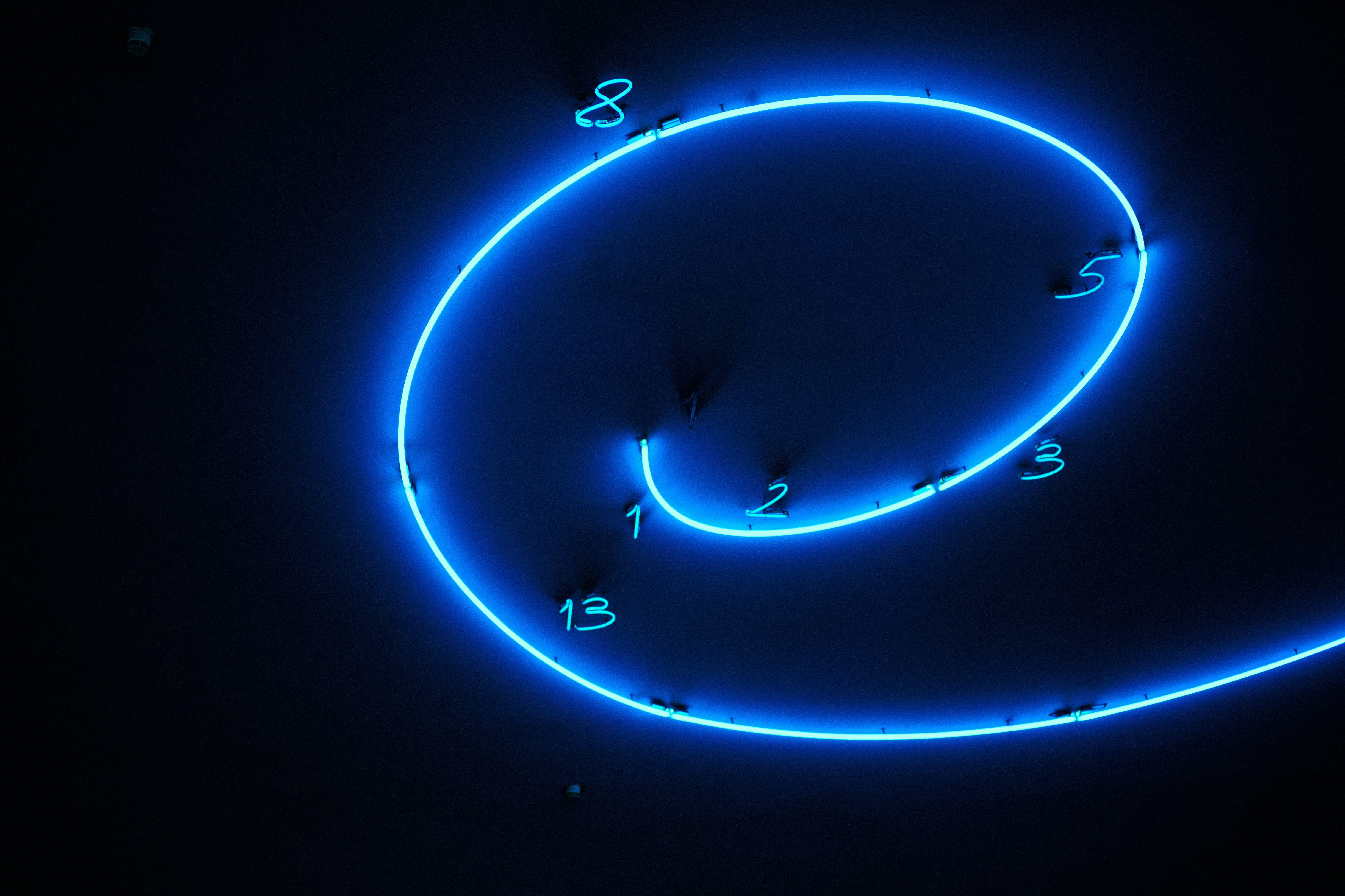 A blue circle with numbers on it in the dark photo – Free Vanvitelli ...