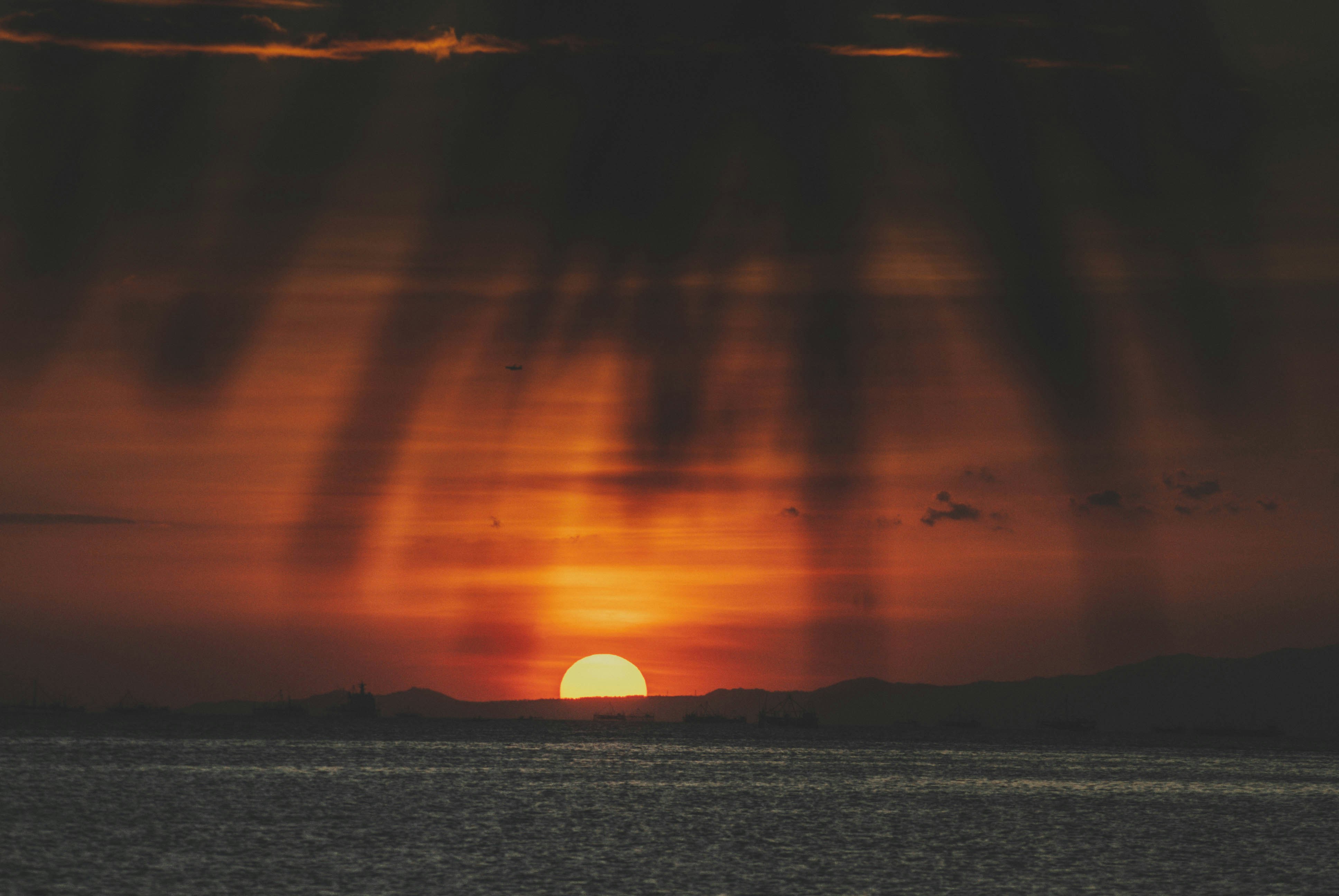Sunset's Quiet Edge: The Low Tide Horizon and Rising Light