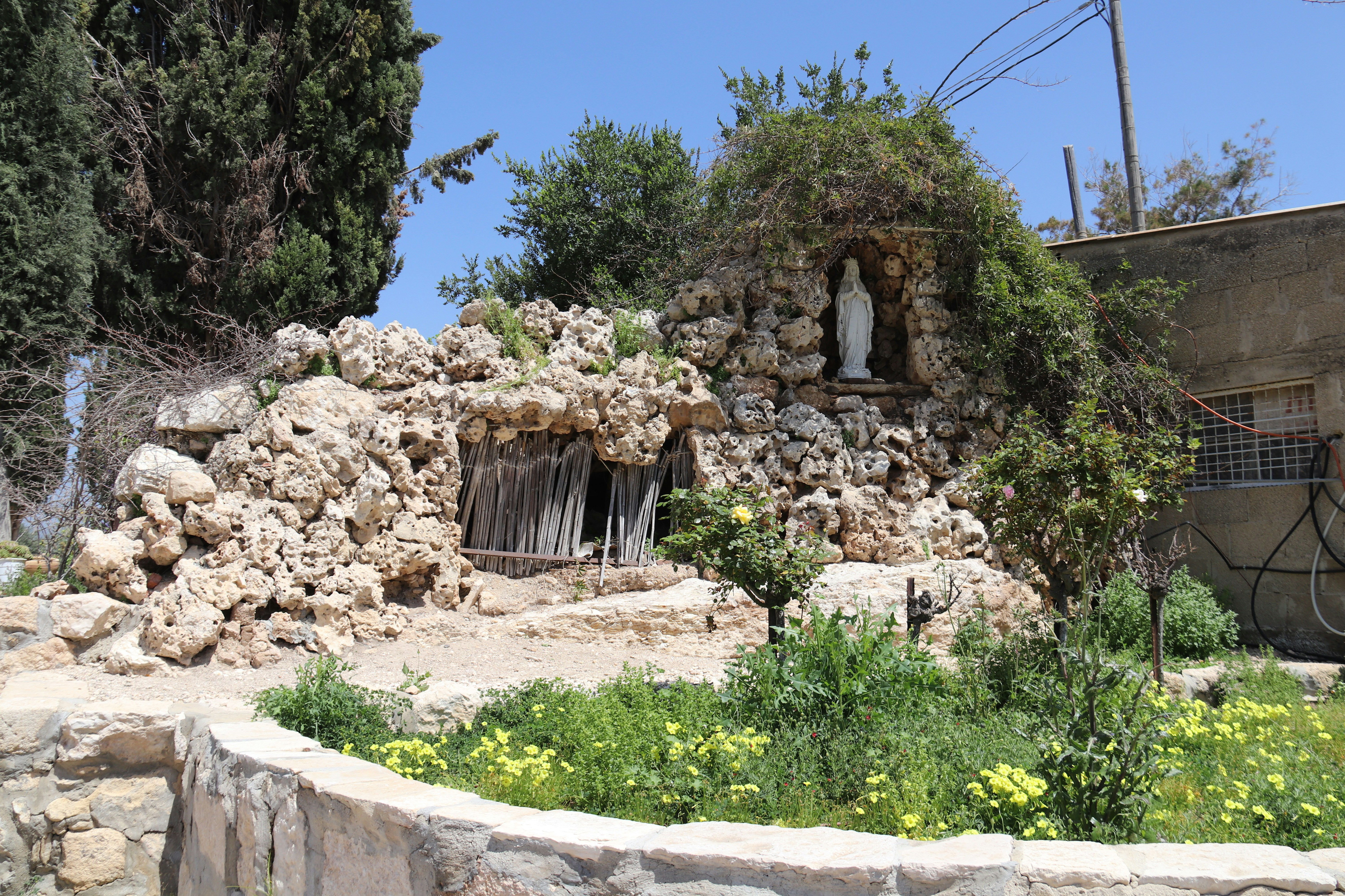 A stone building with a window and a door photo – Free Beit jimal Image ...
