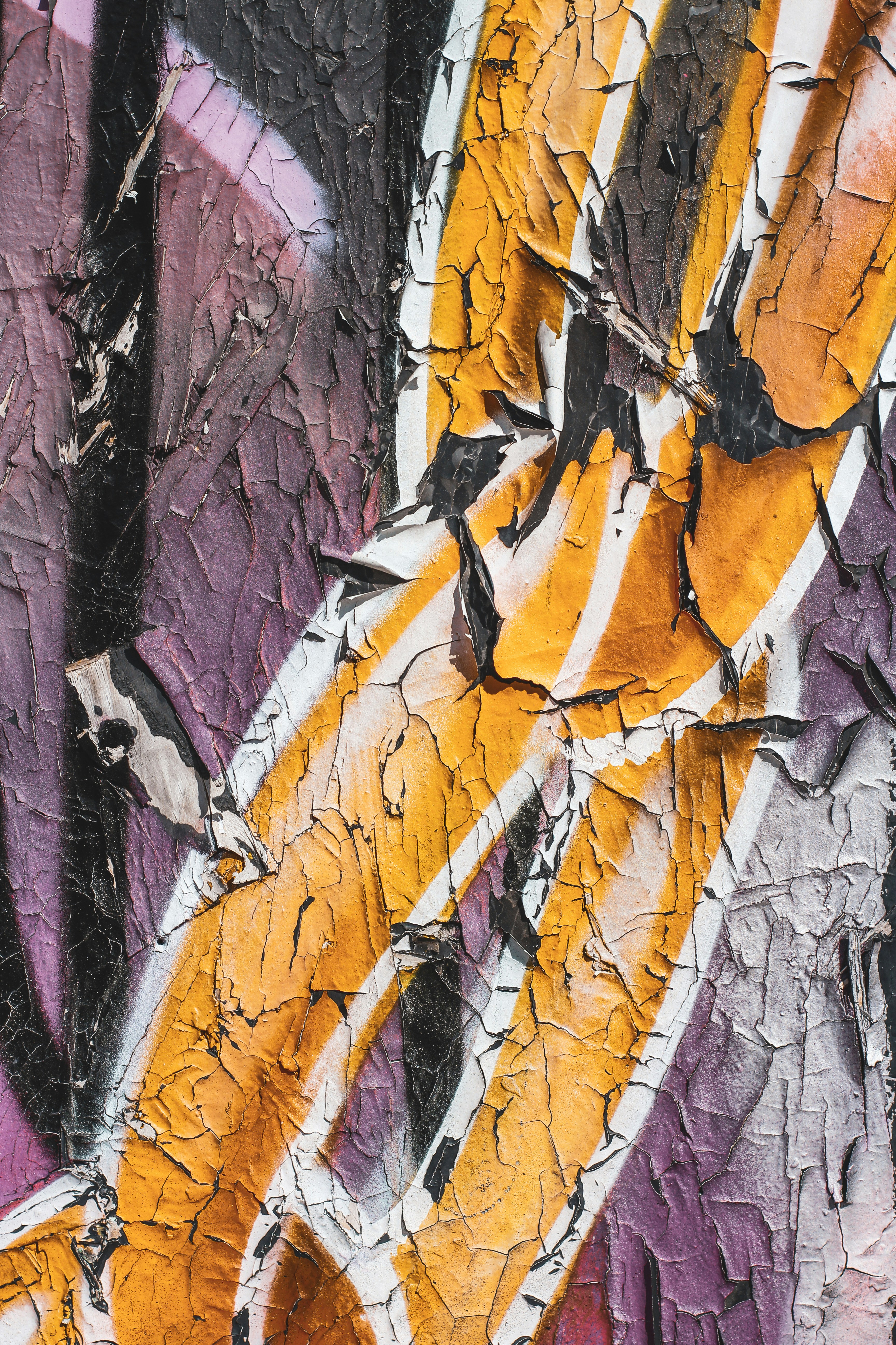 Cracked Orange Diagonals: Weathered Purple Graffiti