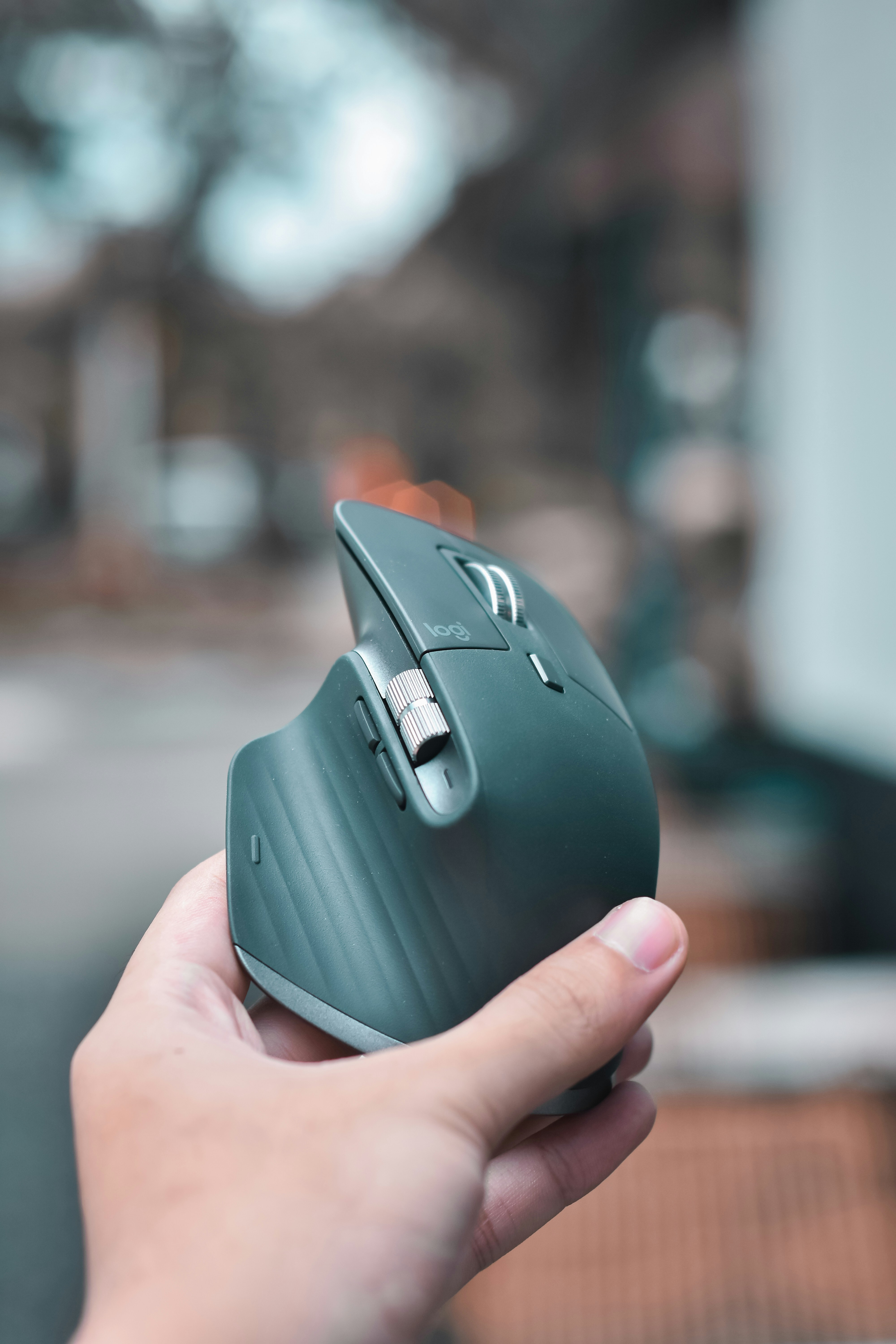 A person holding a computer mouse in their hand photo – Free Grey Image ...