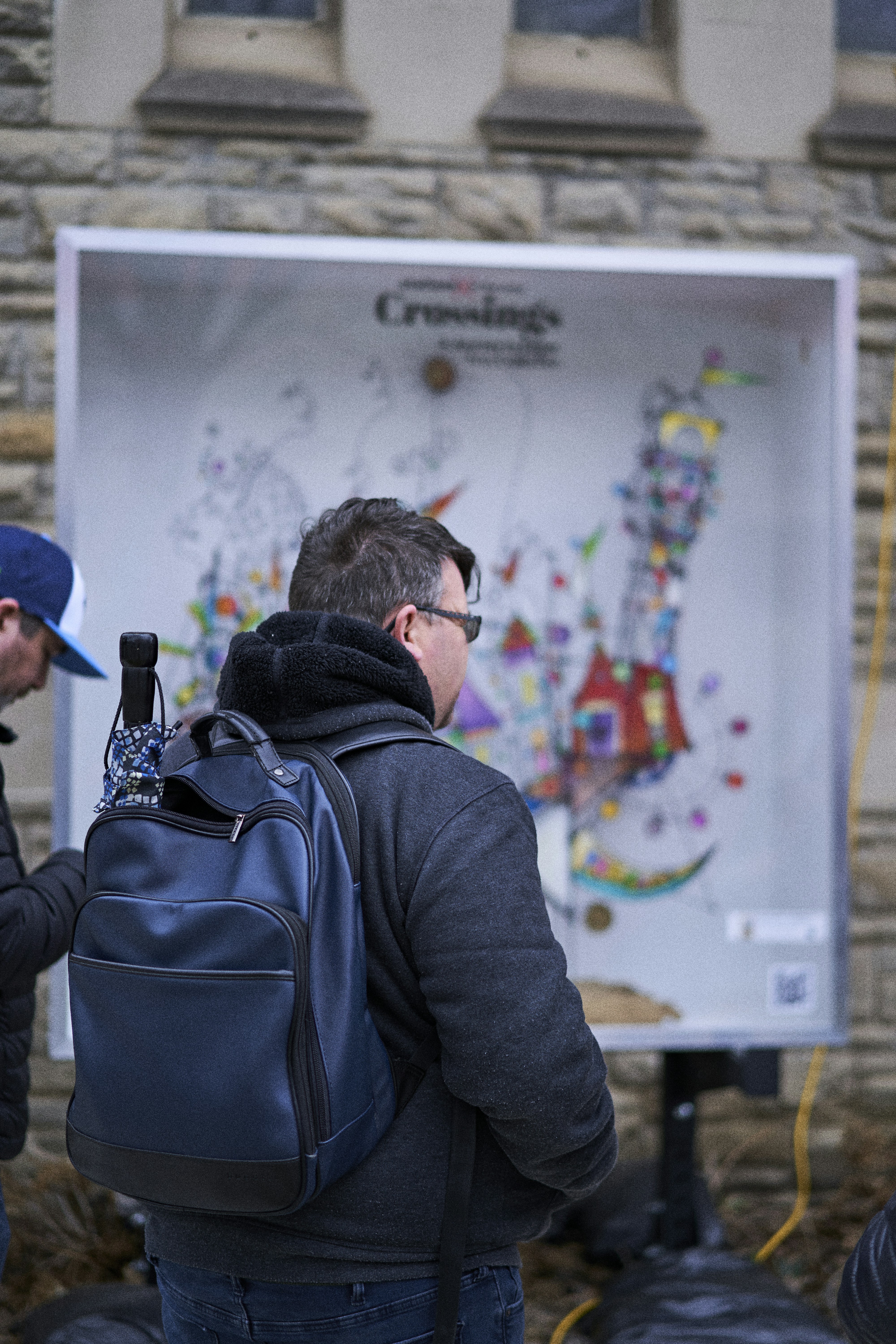 A couple of men standing next to each other photo – Free People Image ...