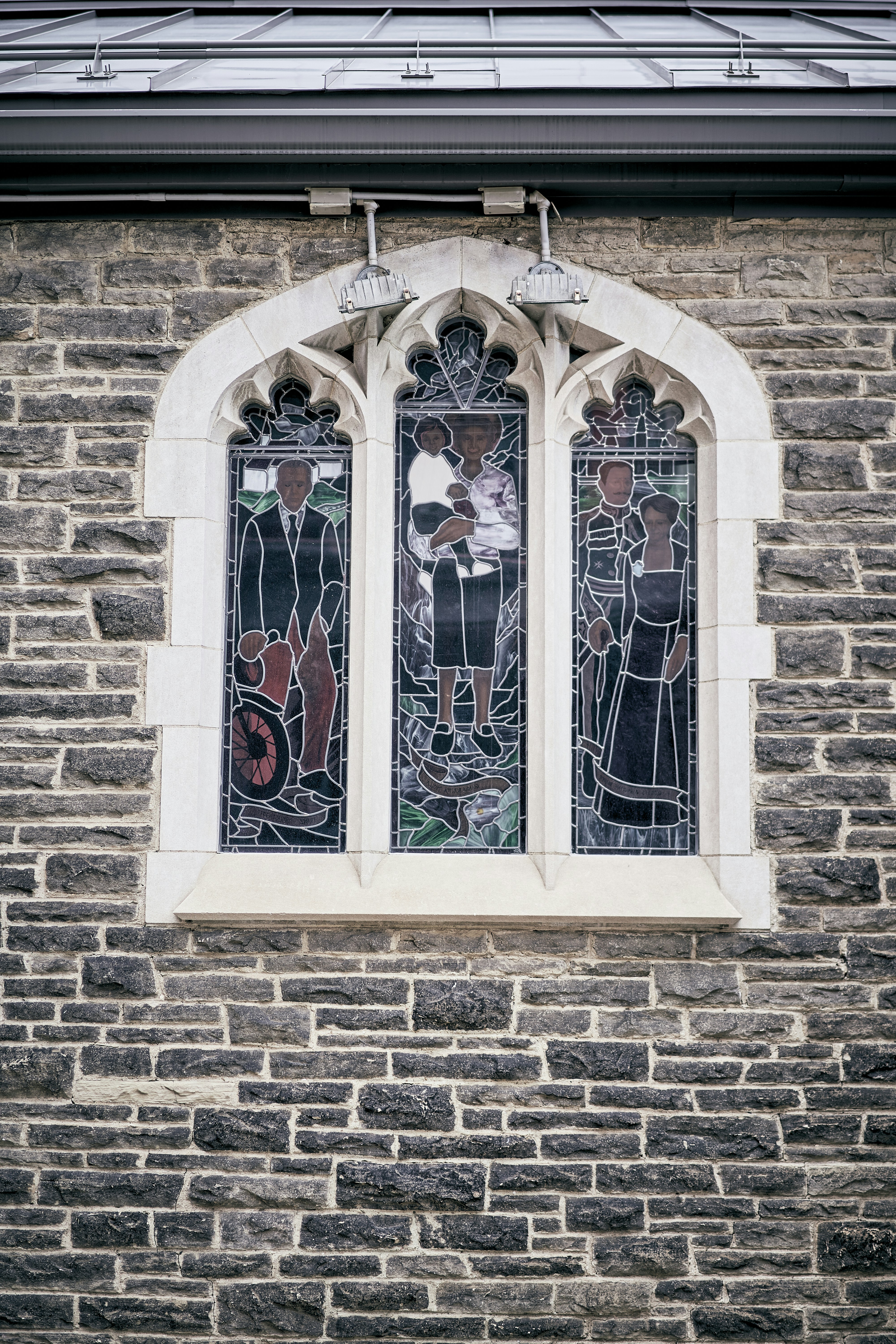 Gothic Glass in Stone: Trio of Figures Within a Centered Arch