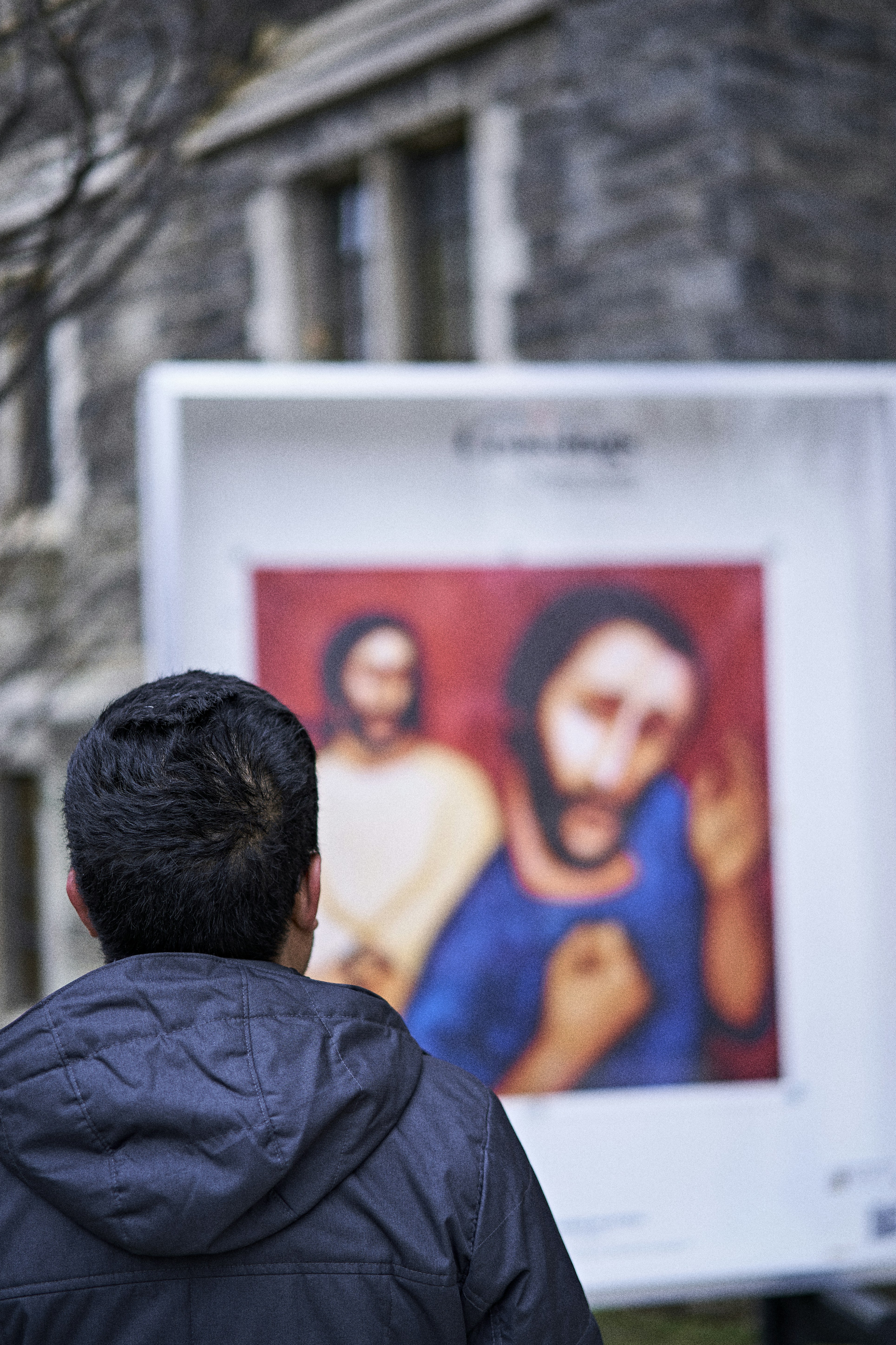 Portrait of a Curious Viewer Before a Street Art Poster