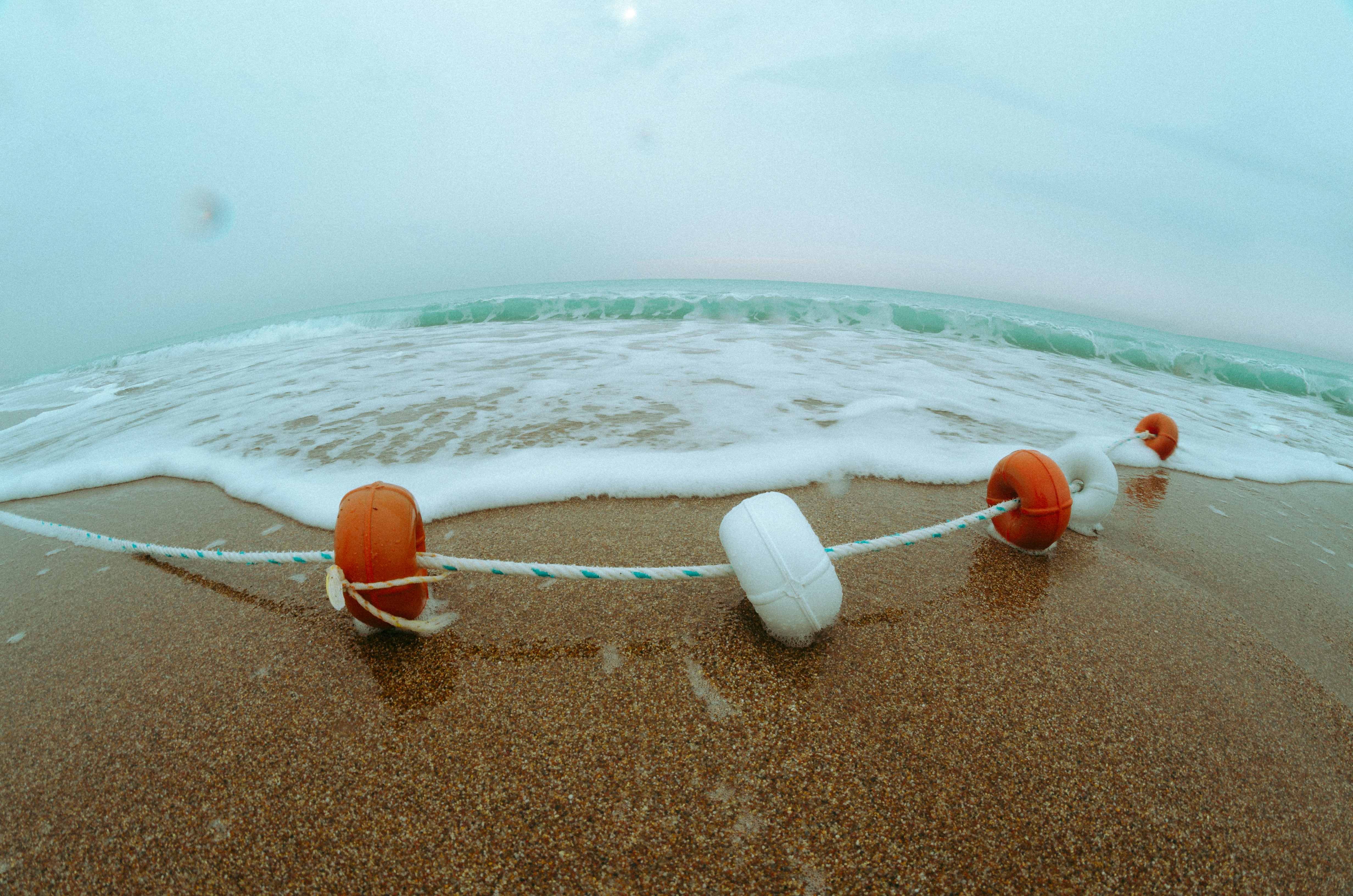 a close up of a small plane sitting on top of a beach