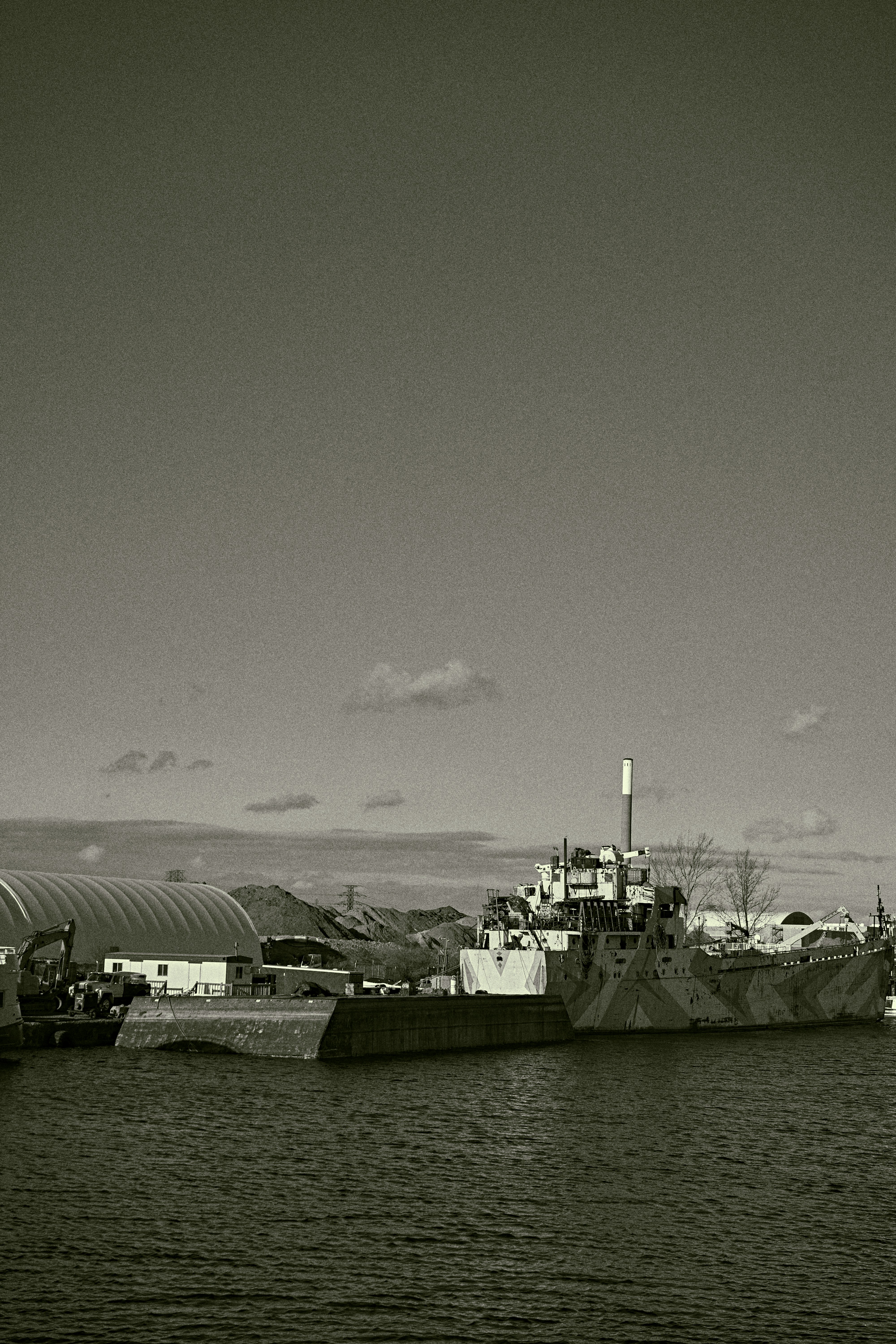 Harbor Sentinel: A Monochrome Battleship at Dockside