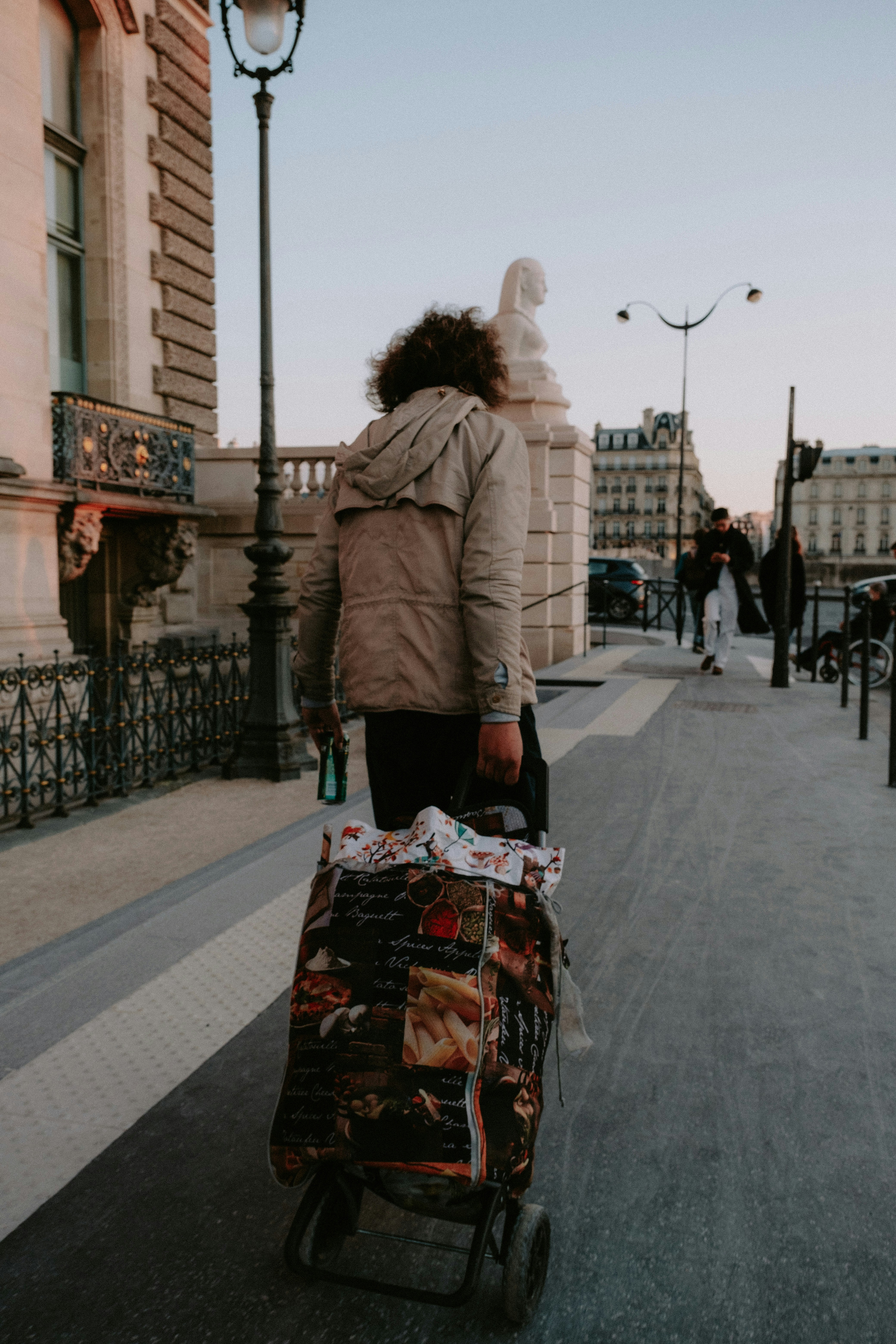 Wheeled Cargo at Dusk: A Quiet European Boulevard Stroll