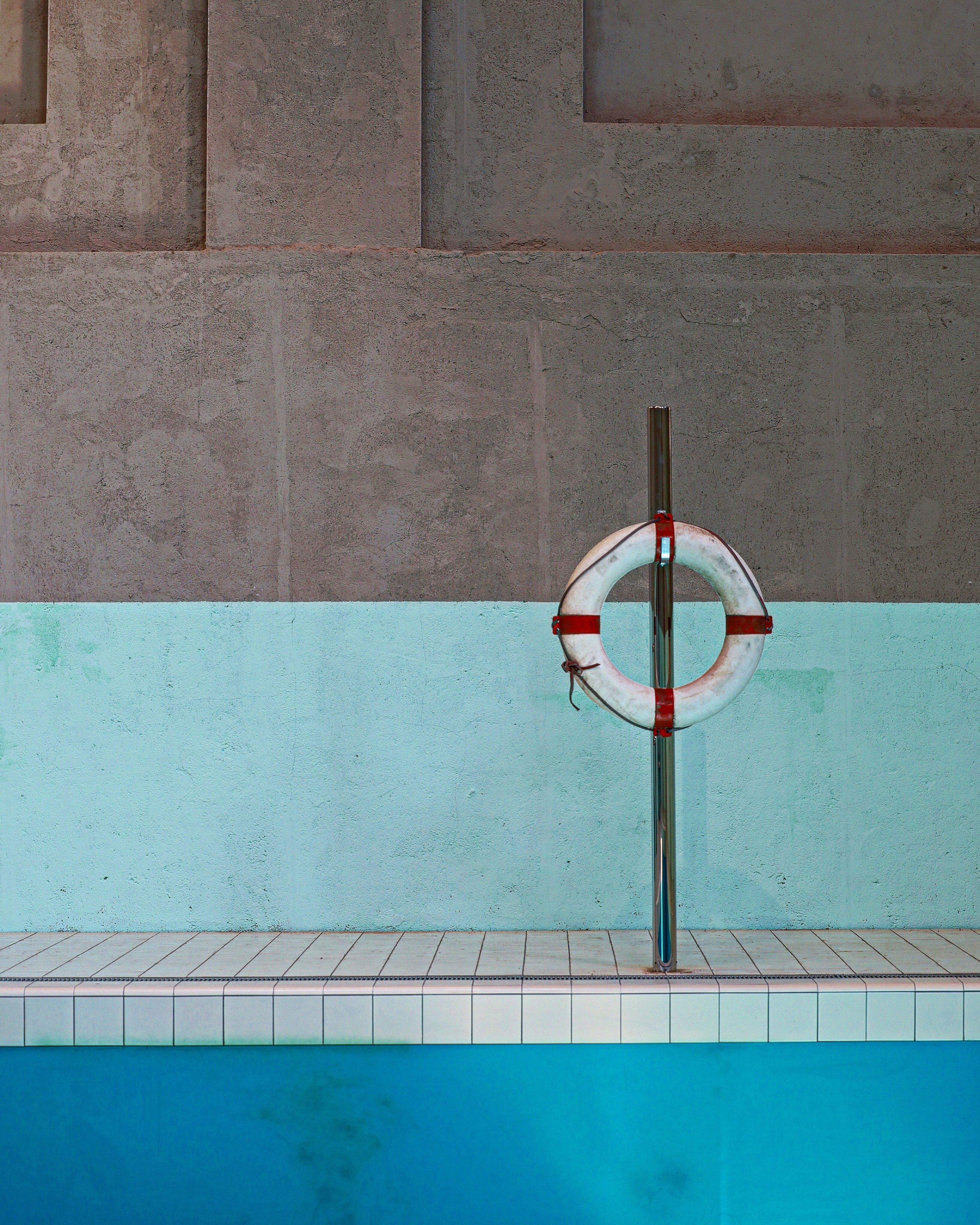 Floating Ring on a Quiet Pool Wall