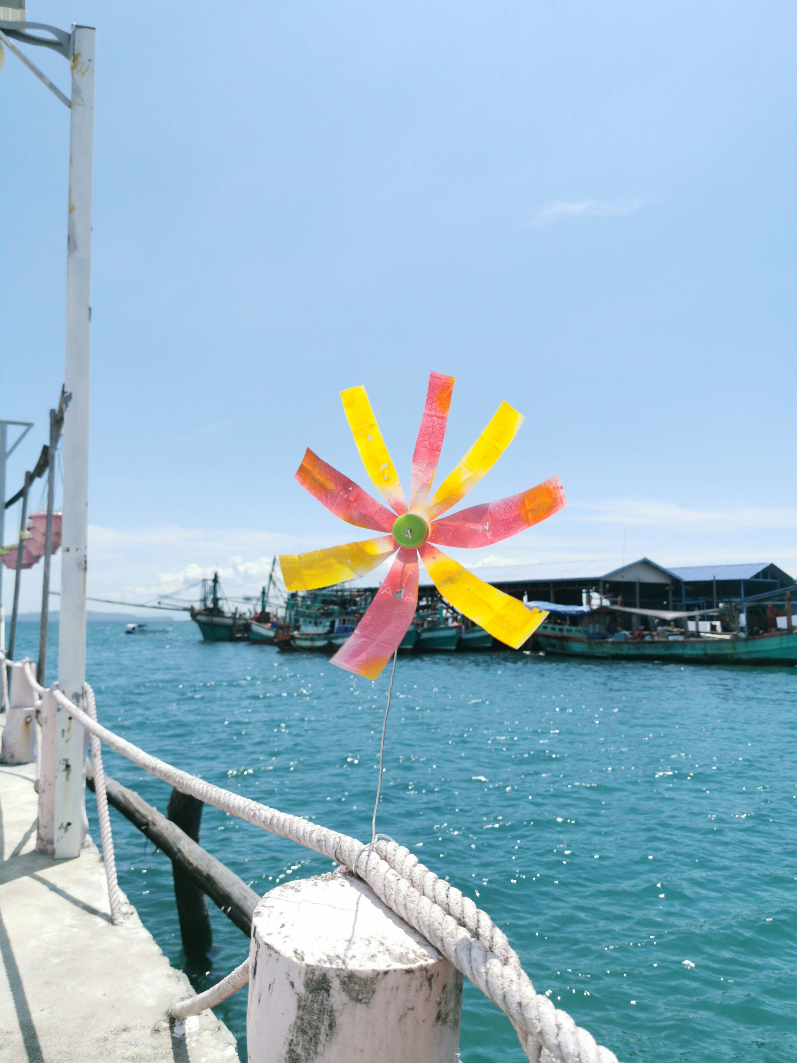 A colorful pinwheel on the side of a boat photo – Free Watercraft Image ...