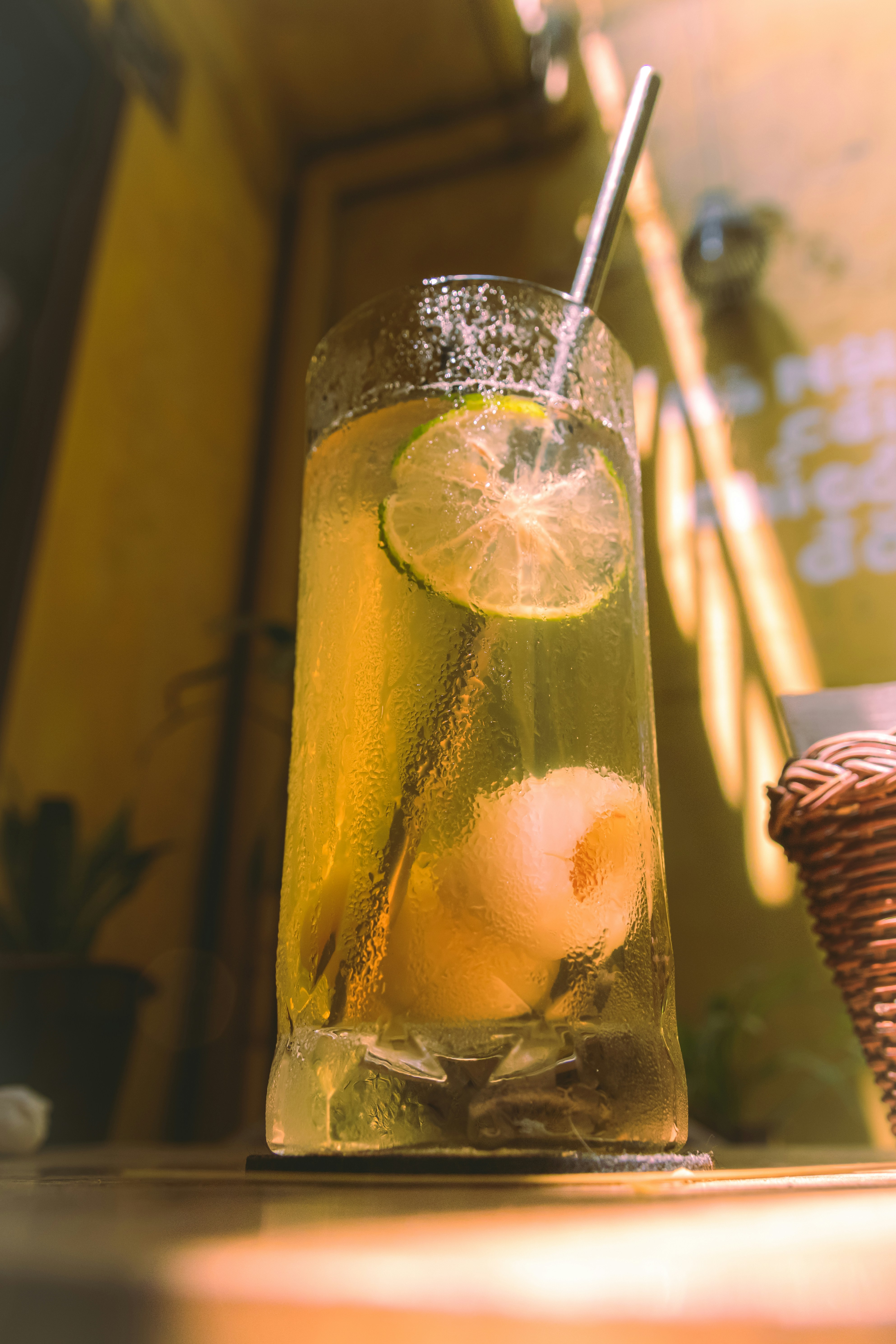 Golden Hour Lemonade: Lime Wheel and Ice Glow on a Sunlit Terrace
