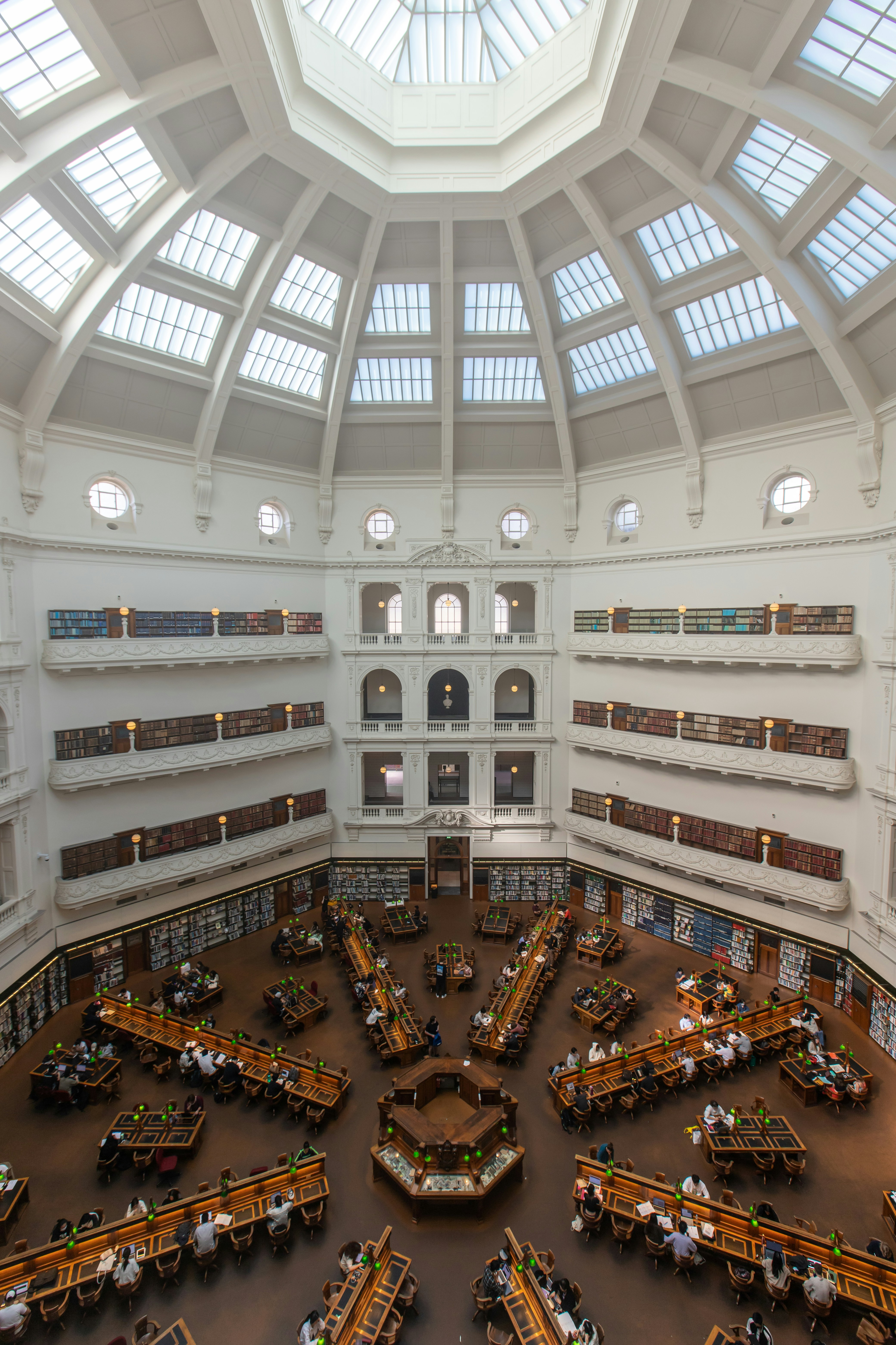 A large library filled with lots of books photo – Free Grey Image on ...