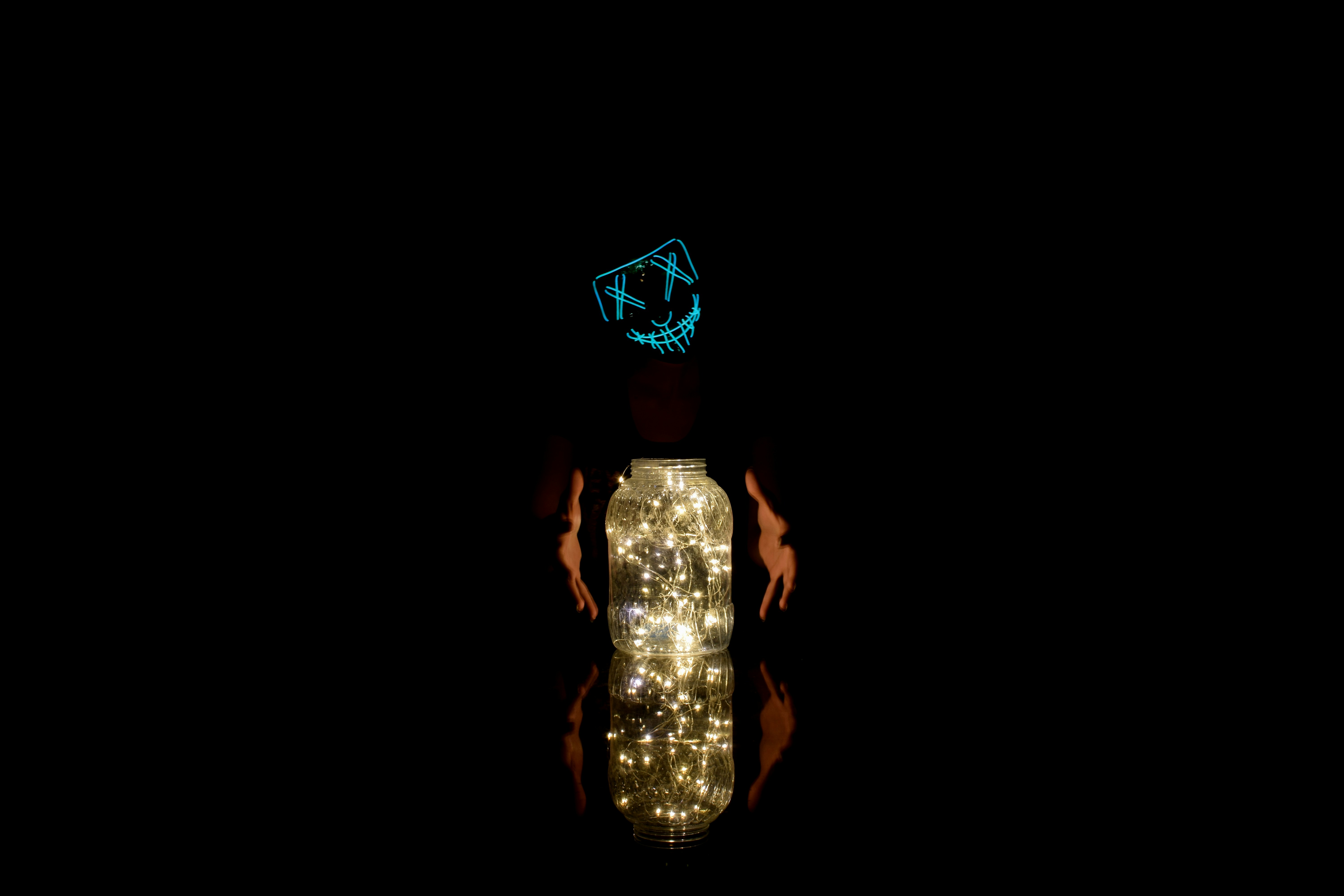 a person standing in the dark with a light on their head