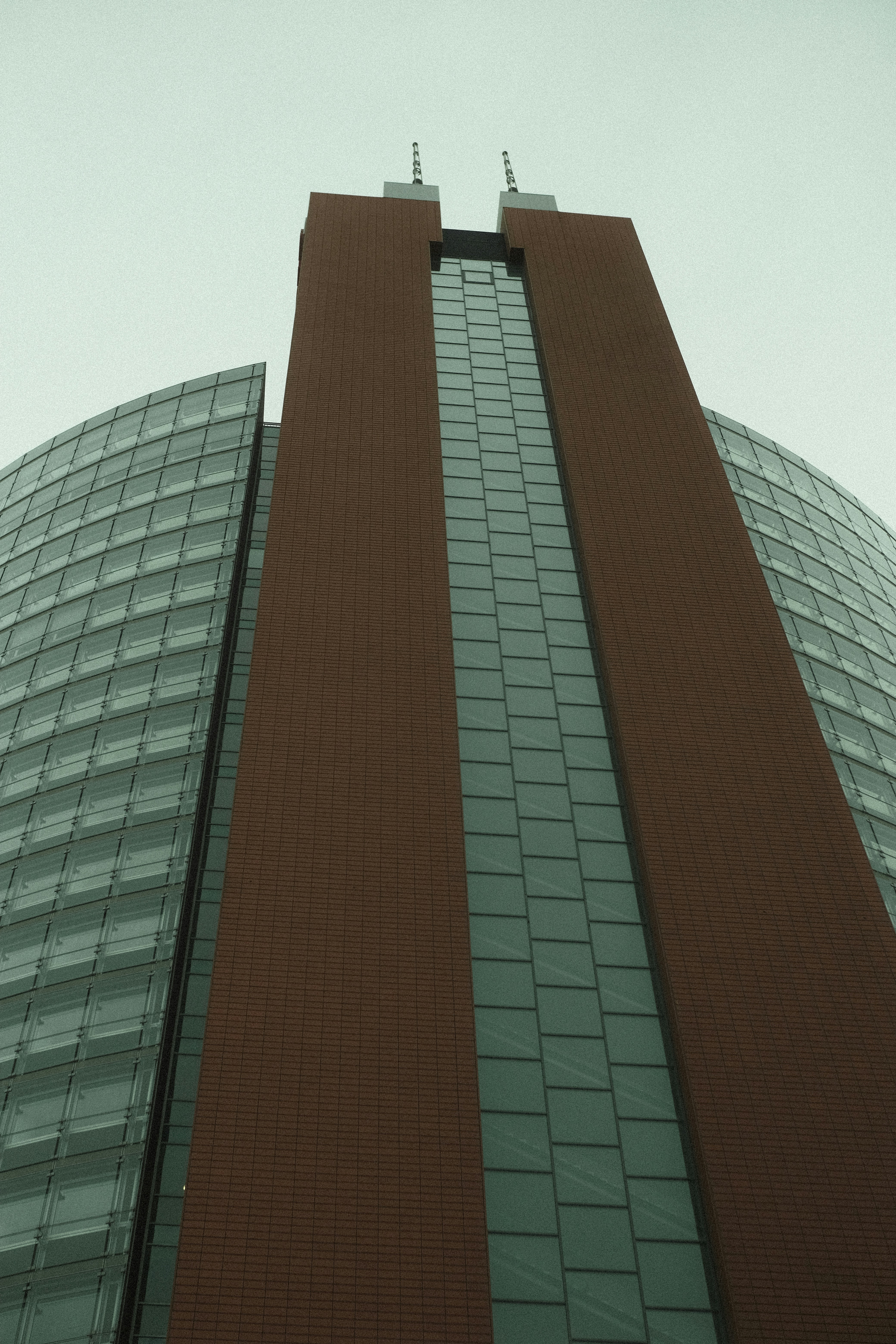 a very tall building with a clock on it's side