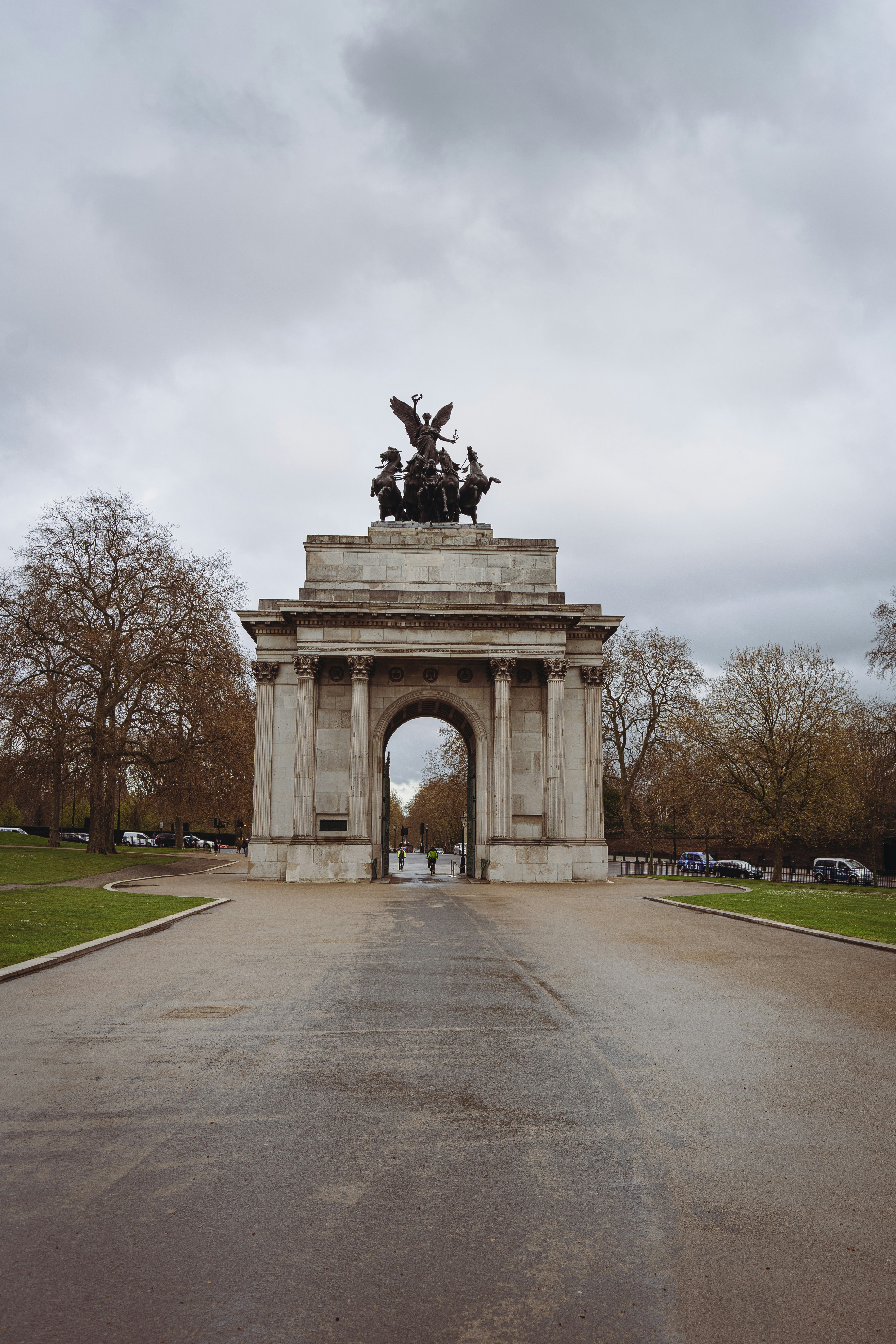 Gateway of Stone: Central Arch Rising Over a Quiet Park Avenue