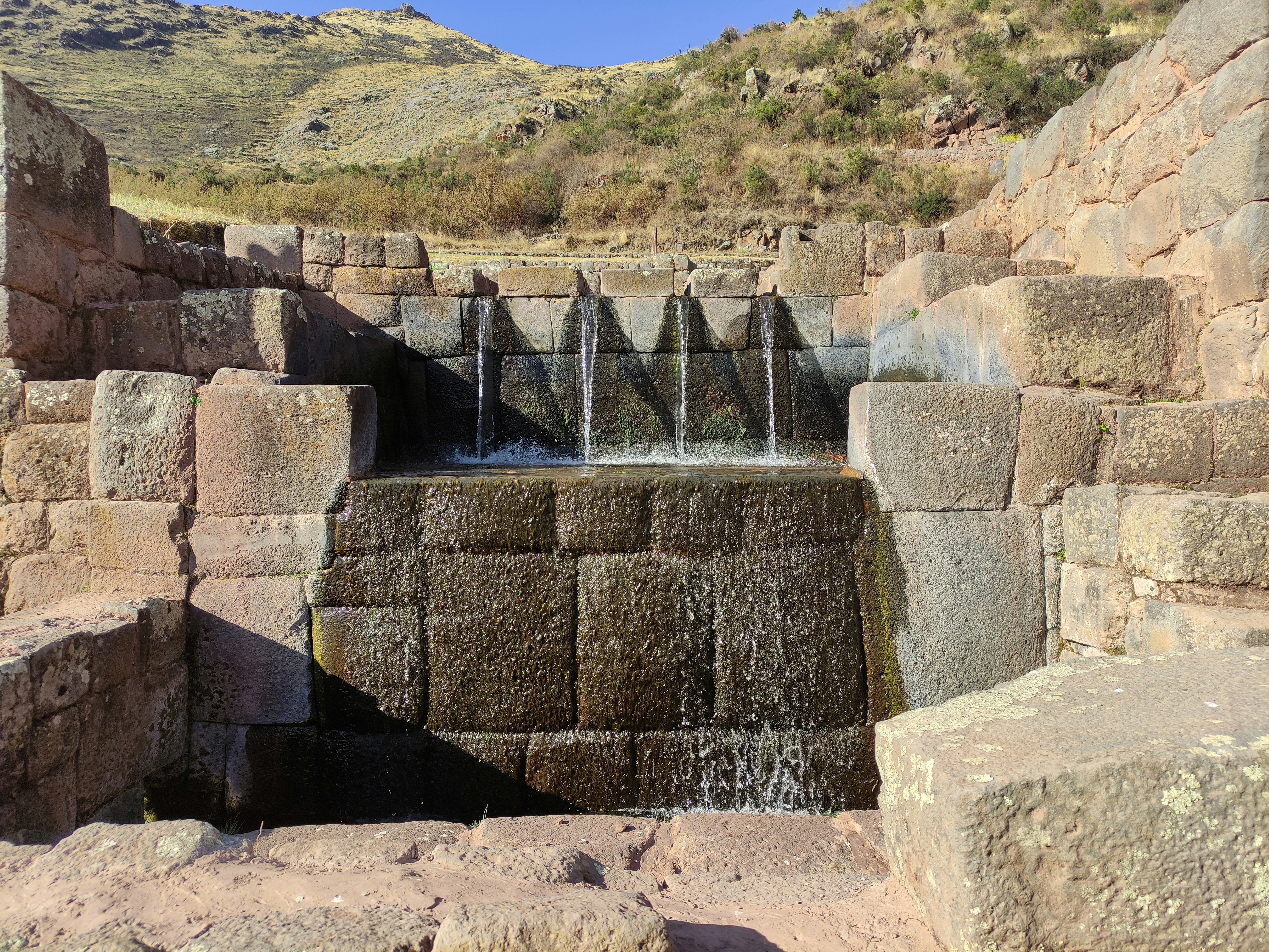 Granite Cascade: Water Steps Framed by Stone Walls