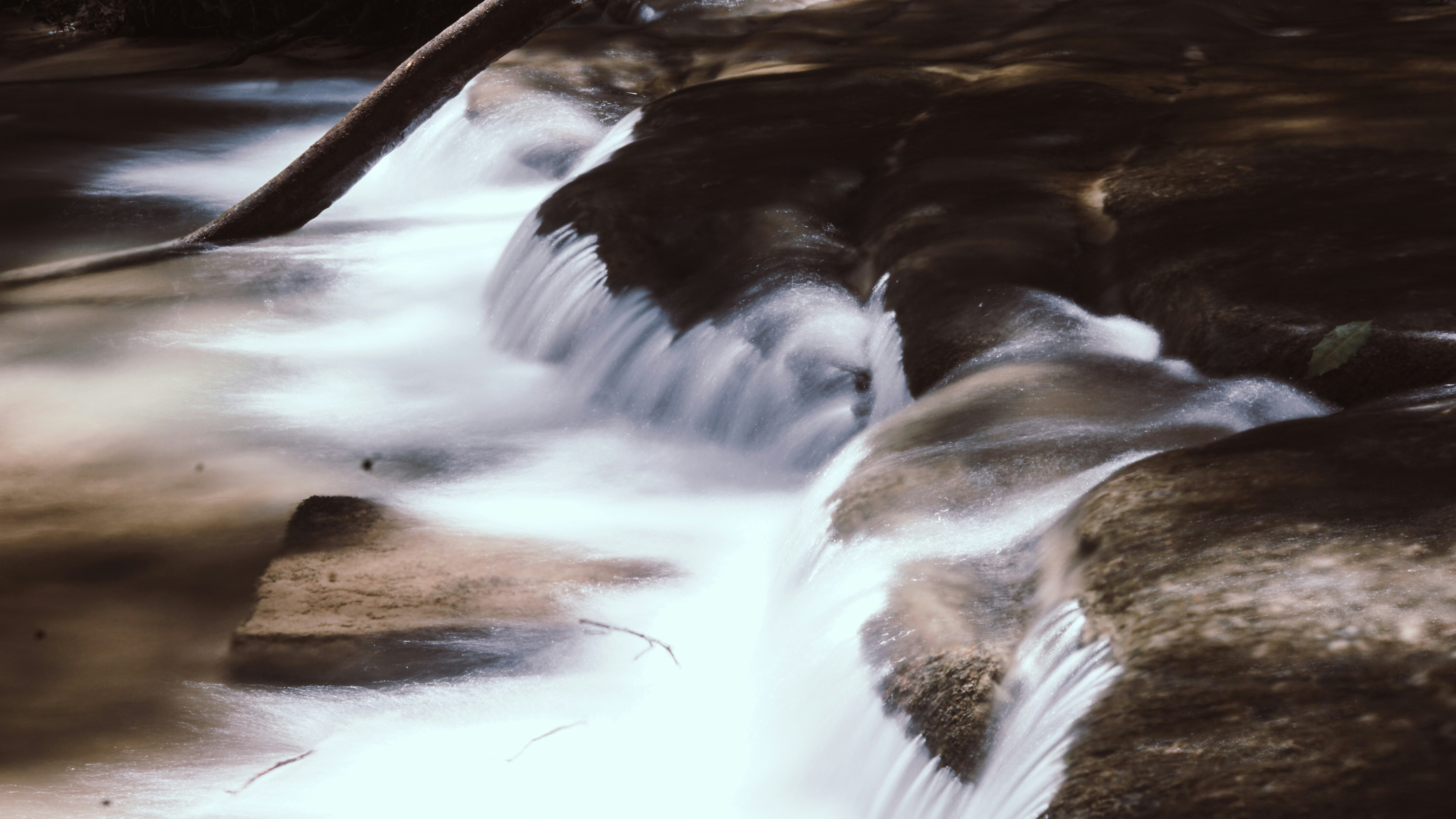 A stream of water running over rocks in a forest photo – Free Alabama ...