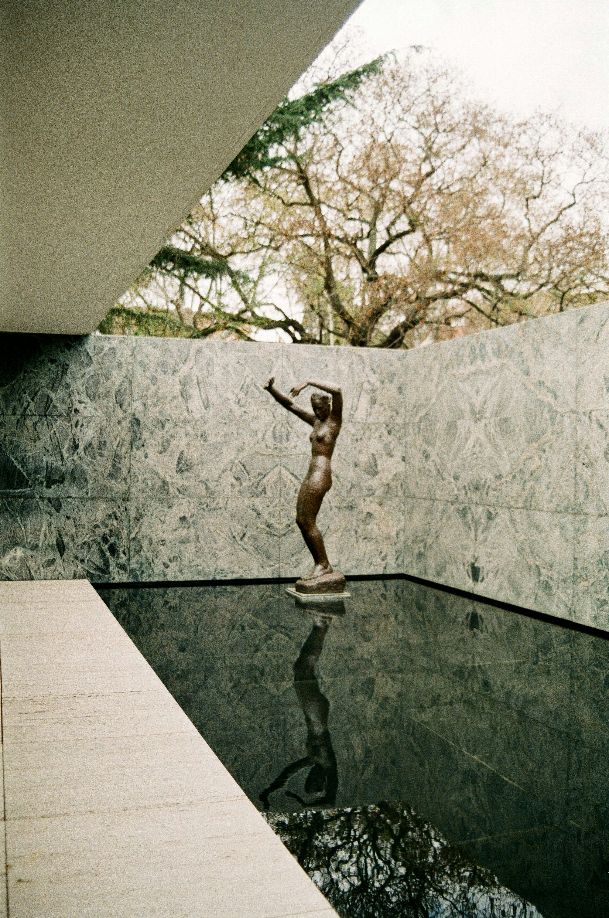 A statue of a woman reaching up into the sky photo – Free Human Image ...