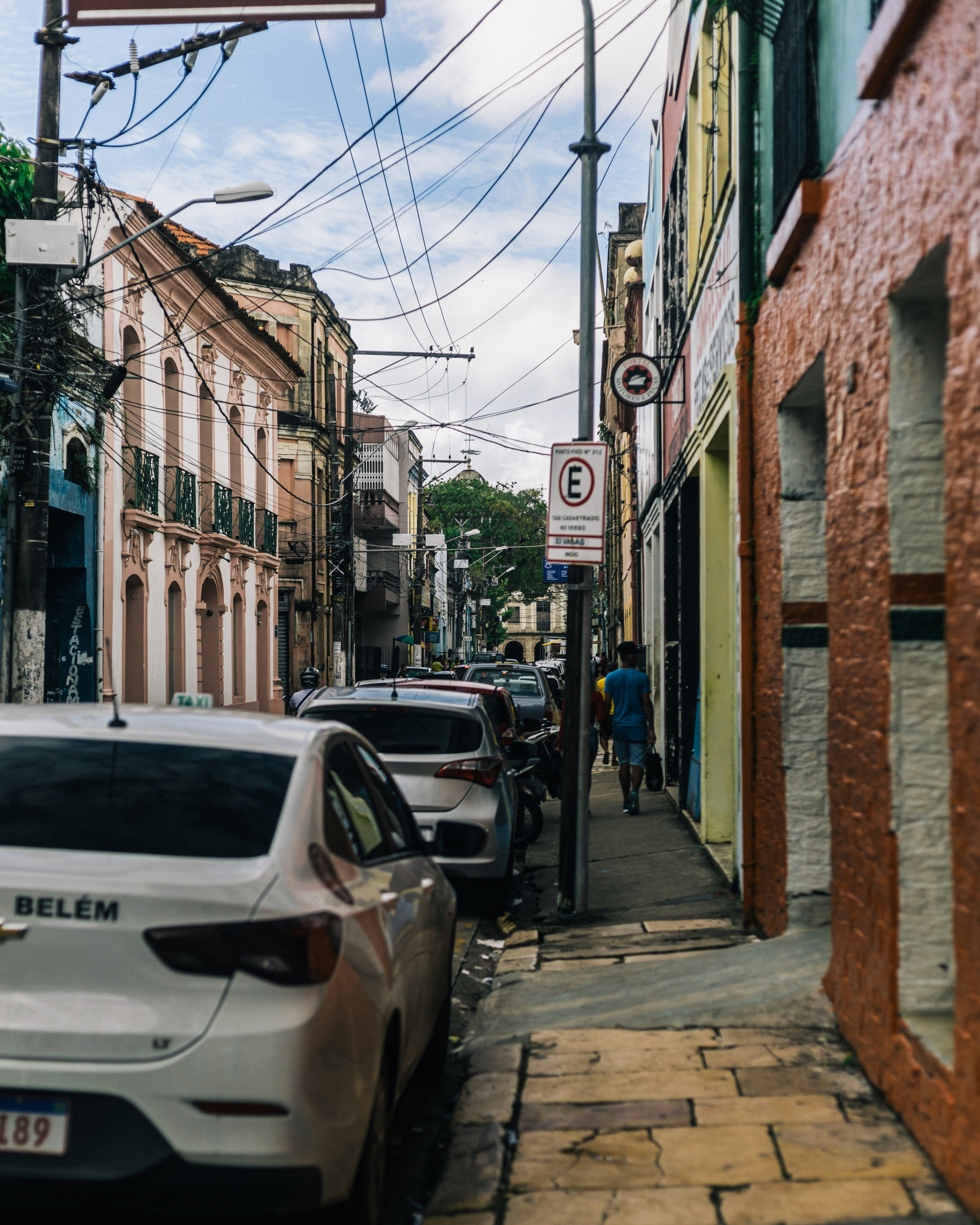 Cars parked on the side of a street next to buildings photo – Free ...