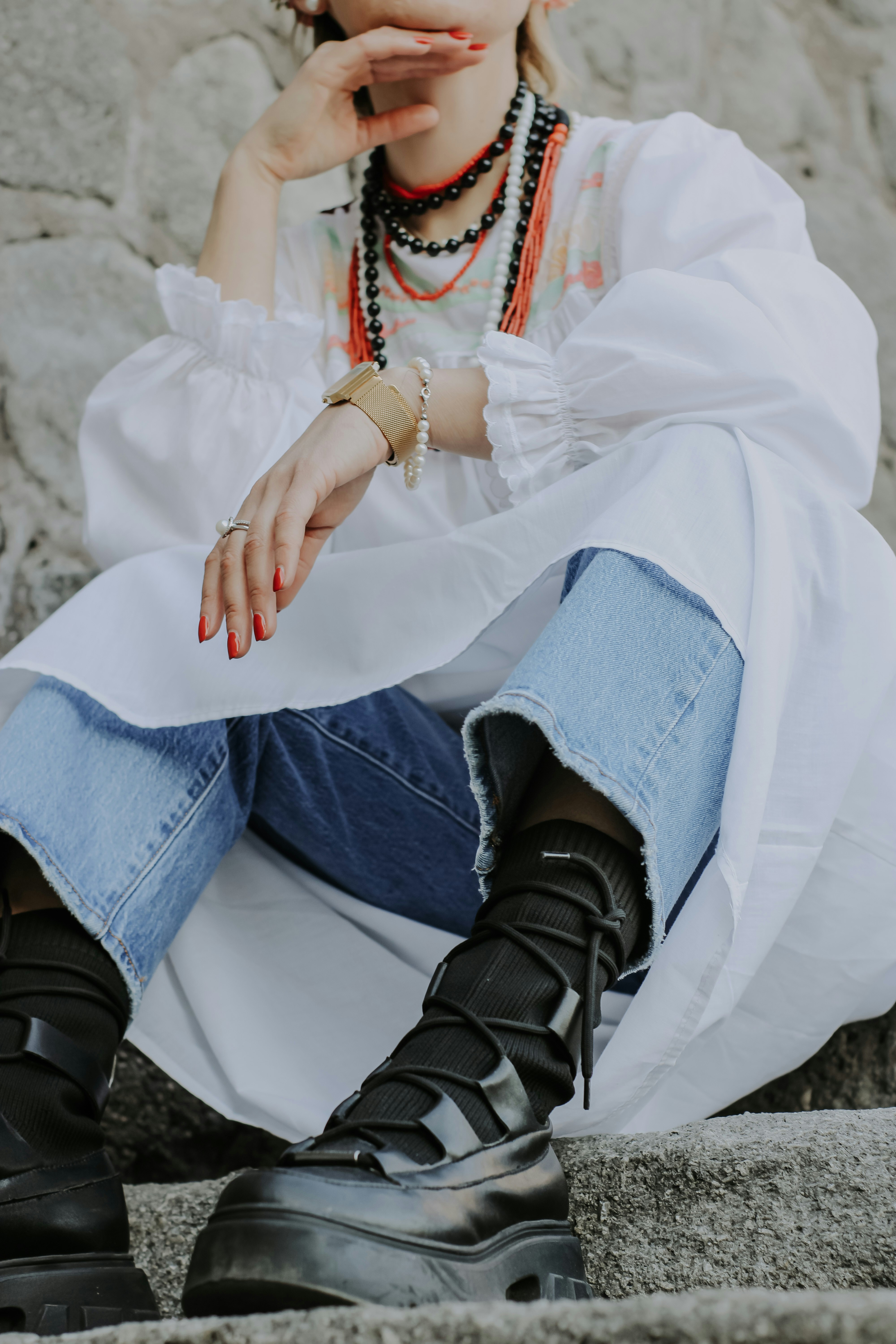 A woman sitting on the steps smoking a cigarette photo – Free Ischia ...