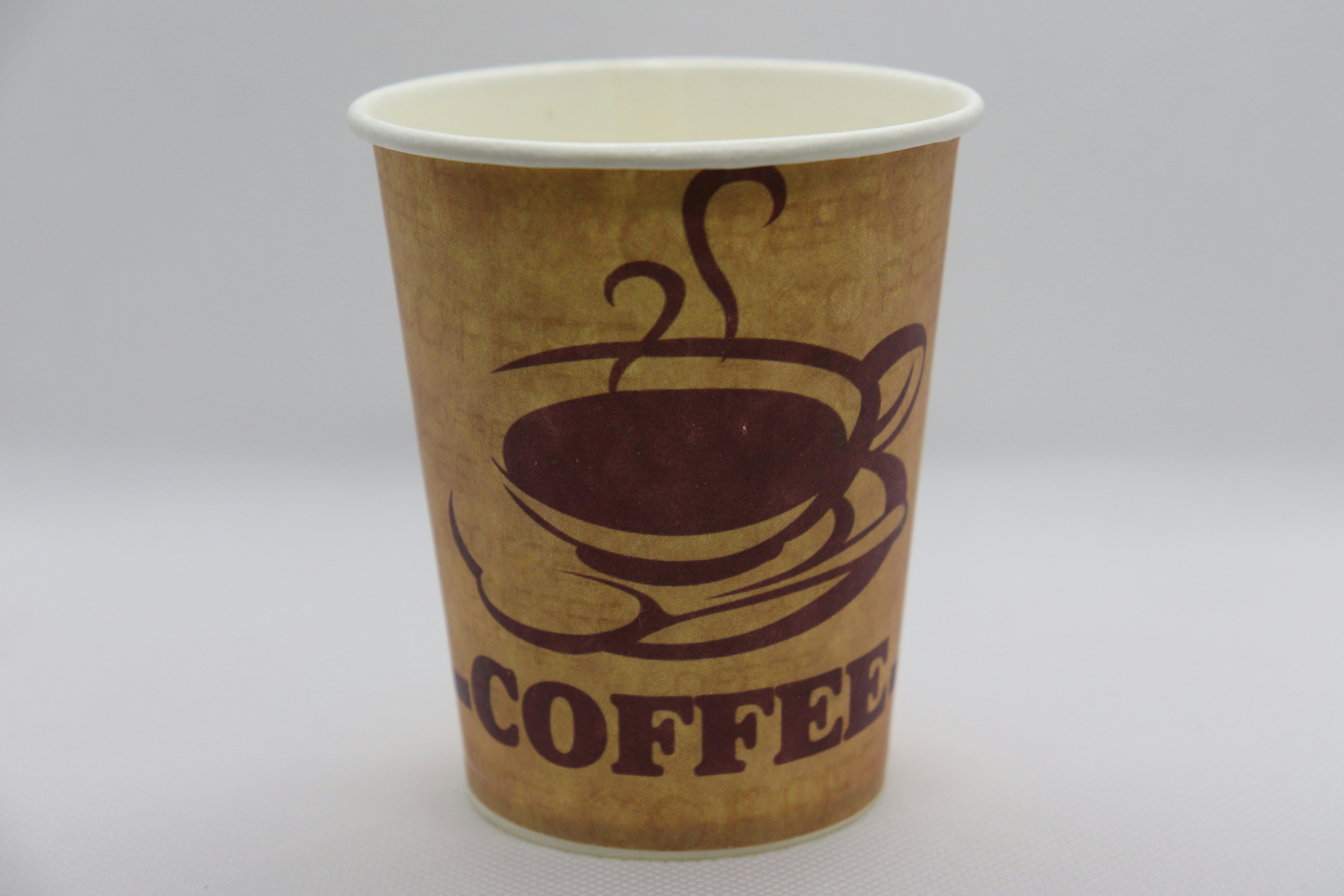 Minimal Espresso Daydream: A Cardboard Cup Centered in Soft Light
