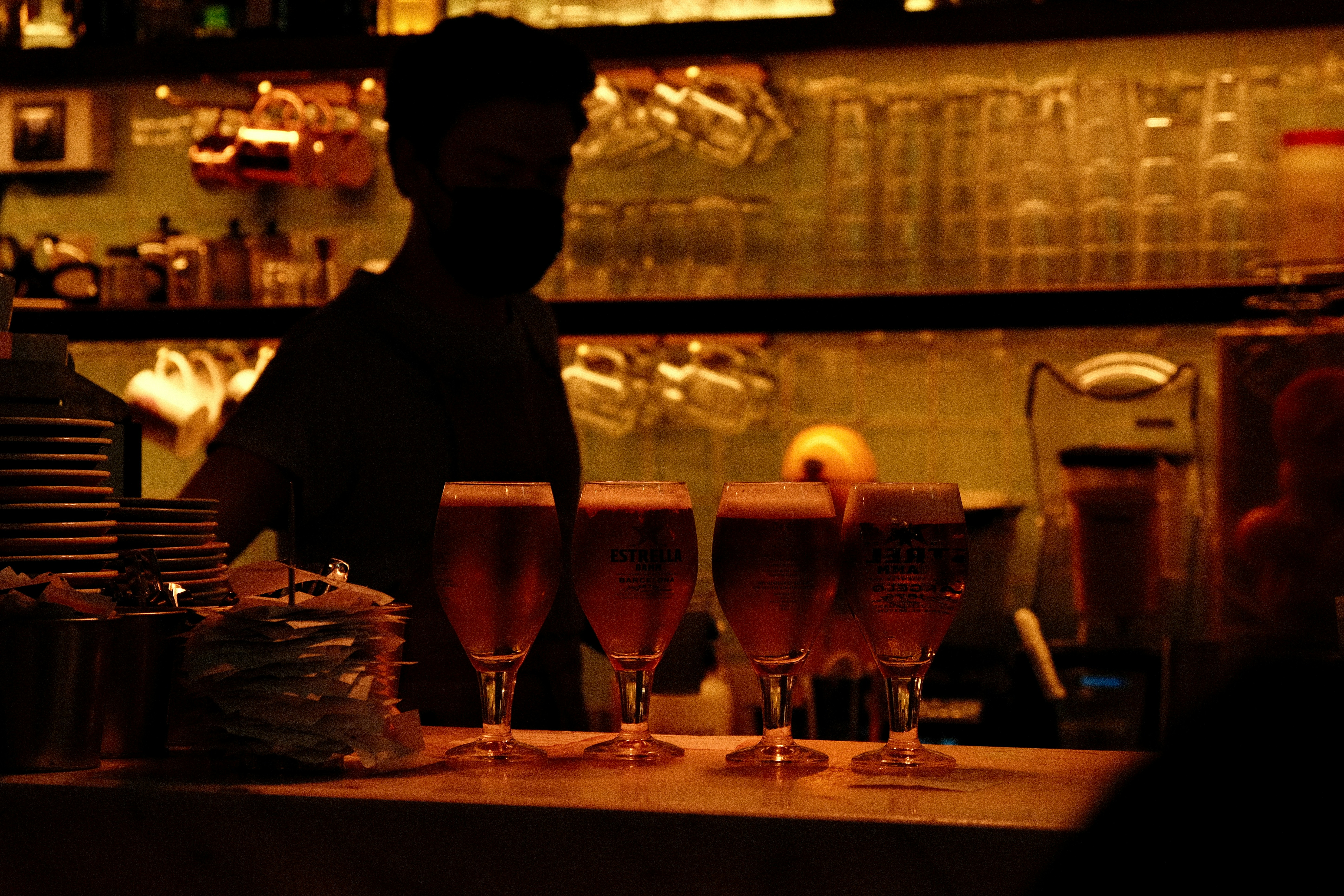 Amber Row at Dusk: Five Glasses on a Shadowed Counter