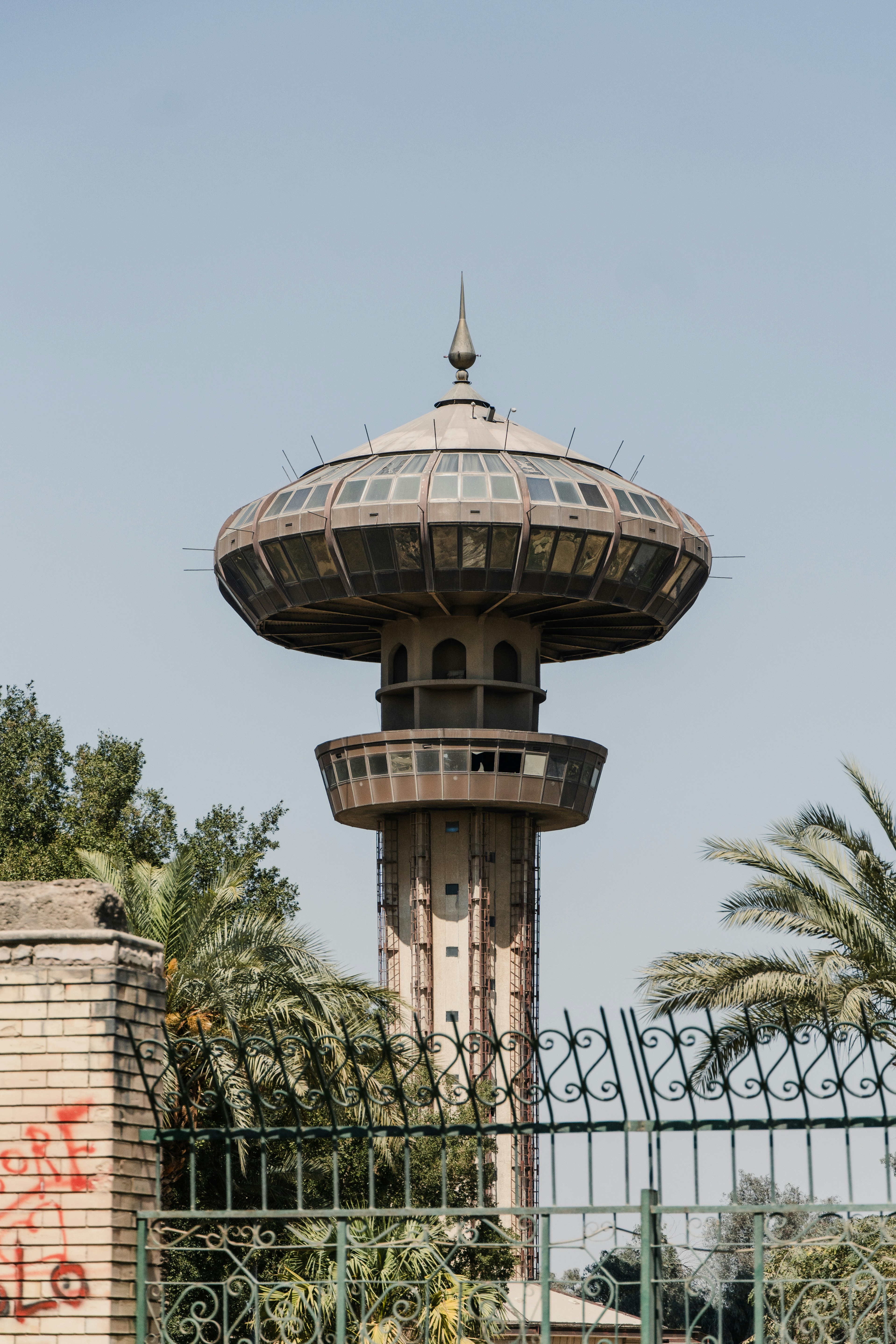 The Sentinel Dome: A Weathered Tower Rising Above a Wrought-Iron Barrier