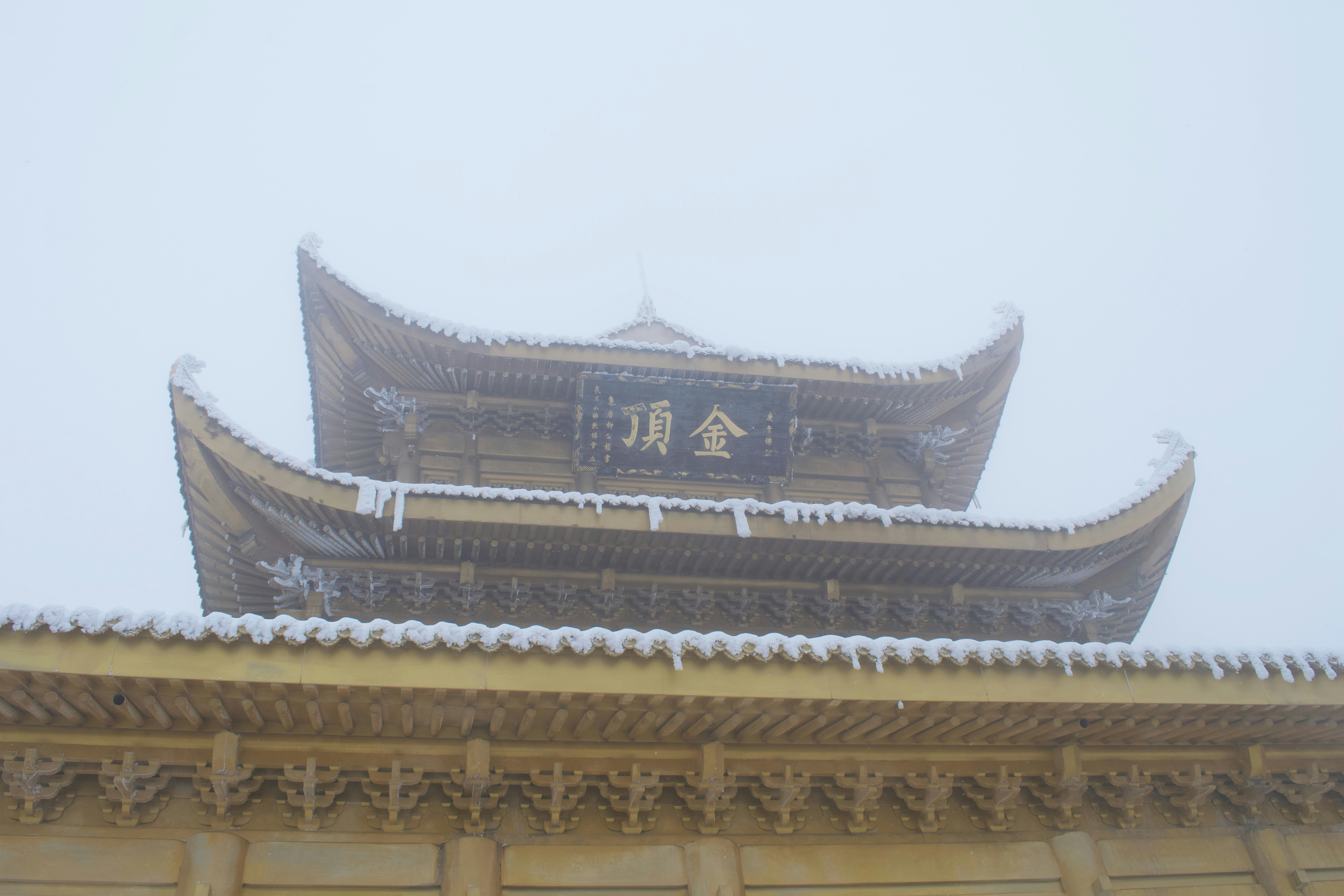 Snowbound Pagoda Crown Under a Pale Sky