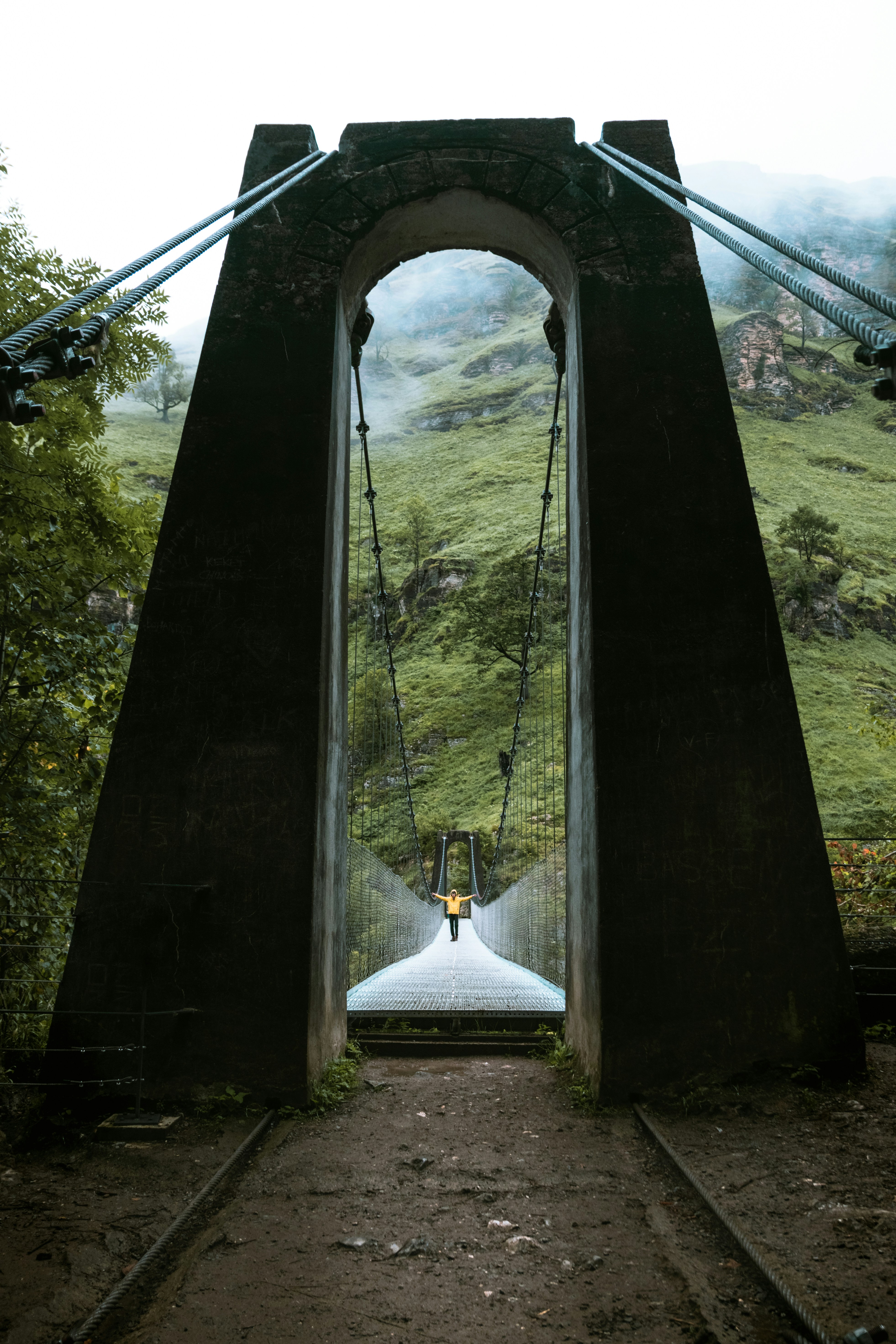 Suspended Path: A Lone Traveler Through the Gate of Mountains
