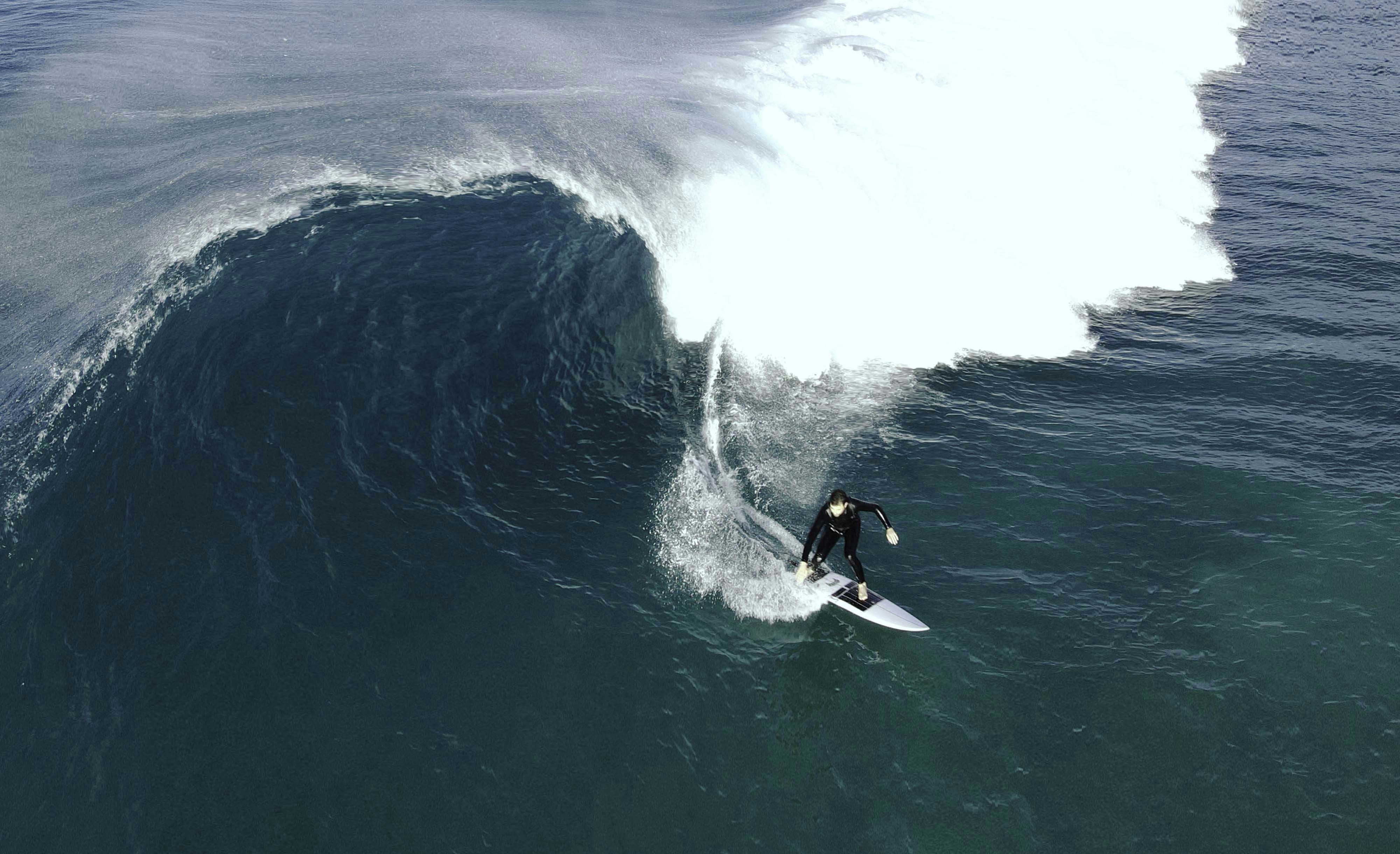 A man riding a wave on top of a surfboard photo – Free Sport Image on ...