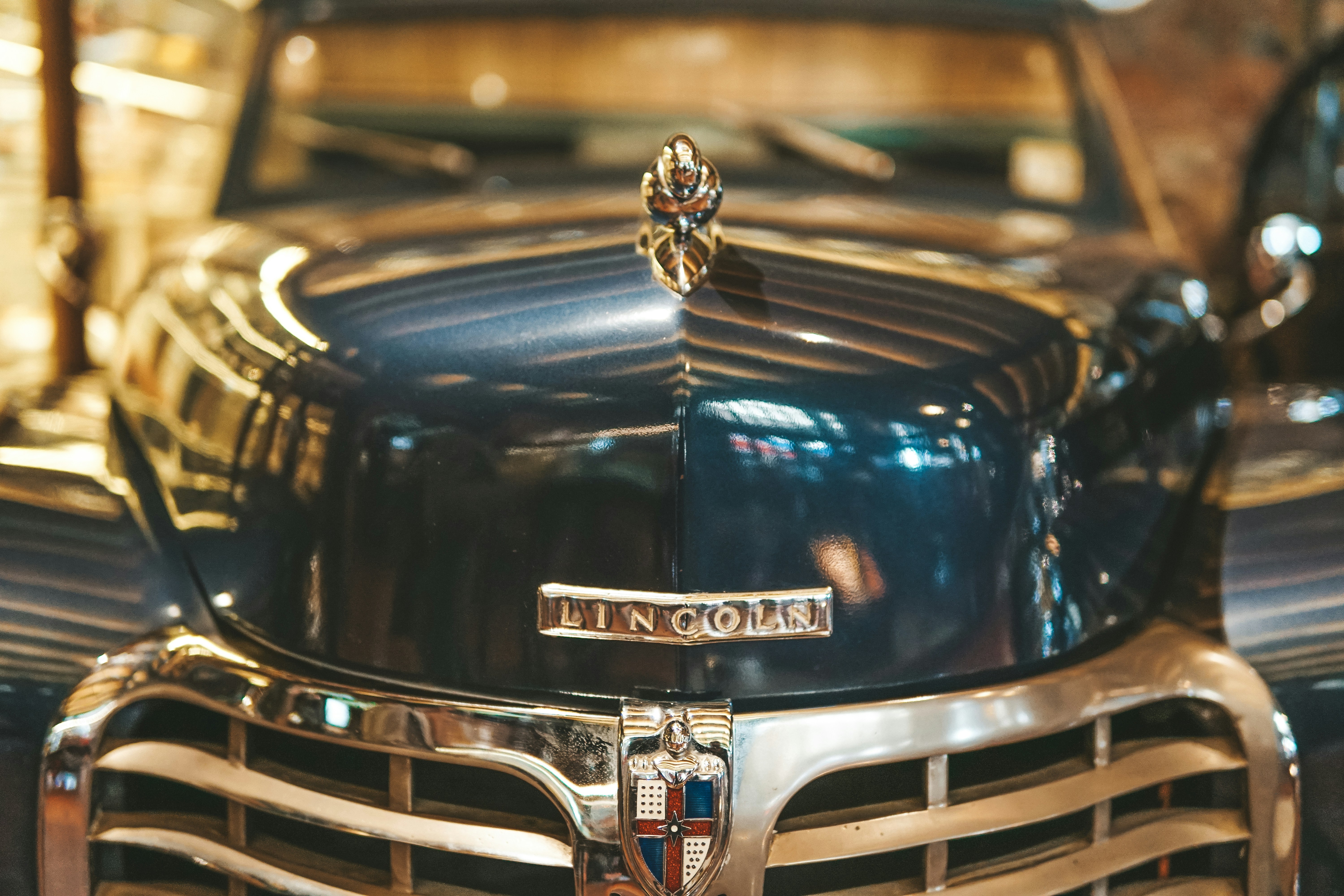 a close up of the front of a classic car