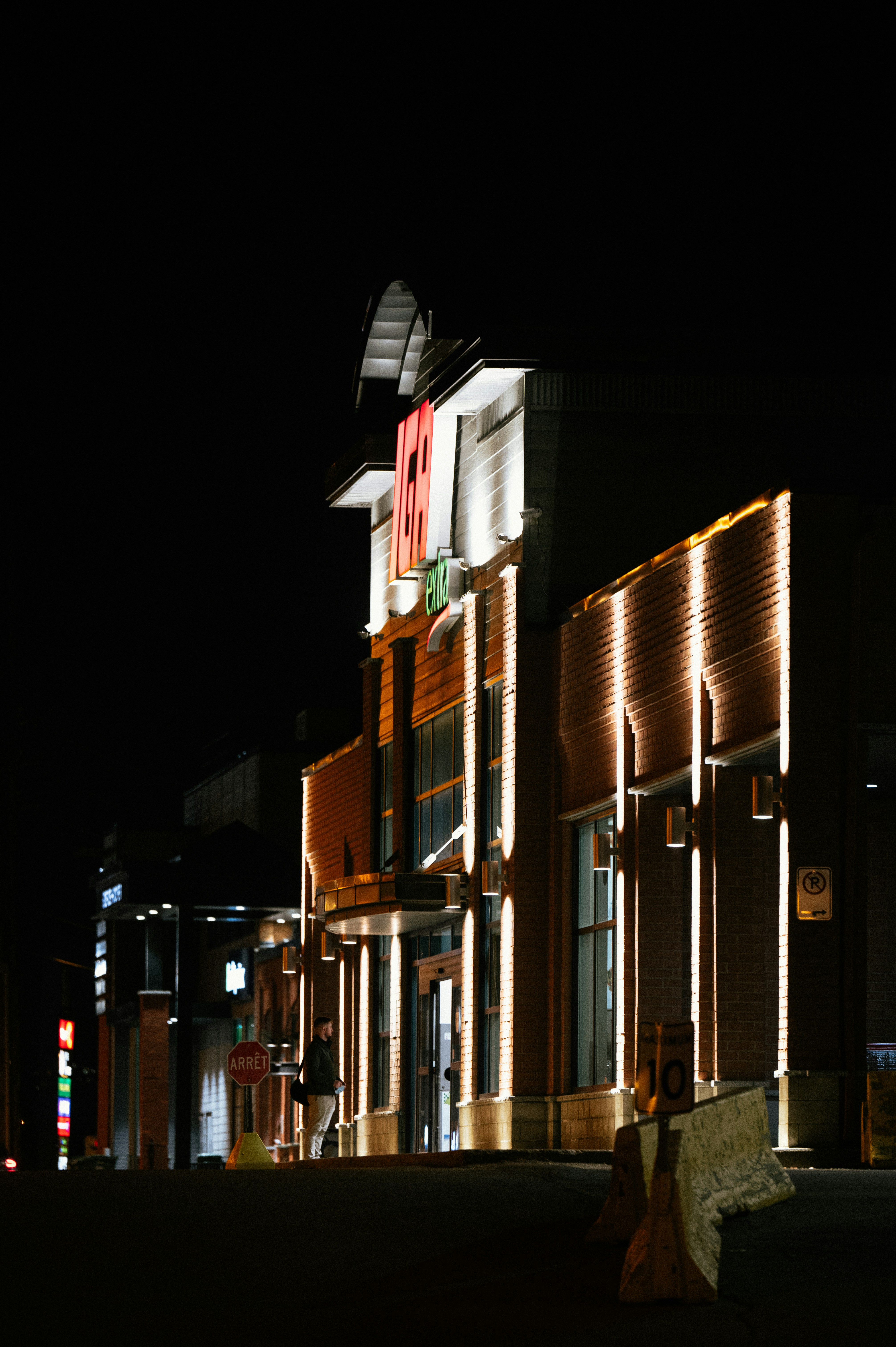 Neon Facade at Dusk: Illuminated Street Scene
