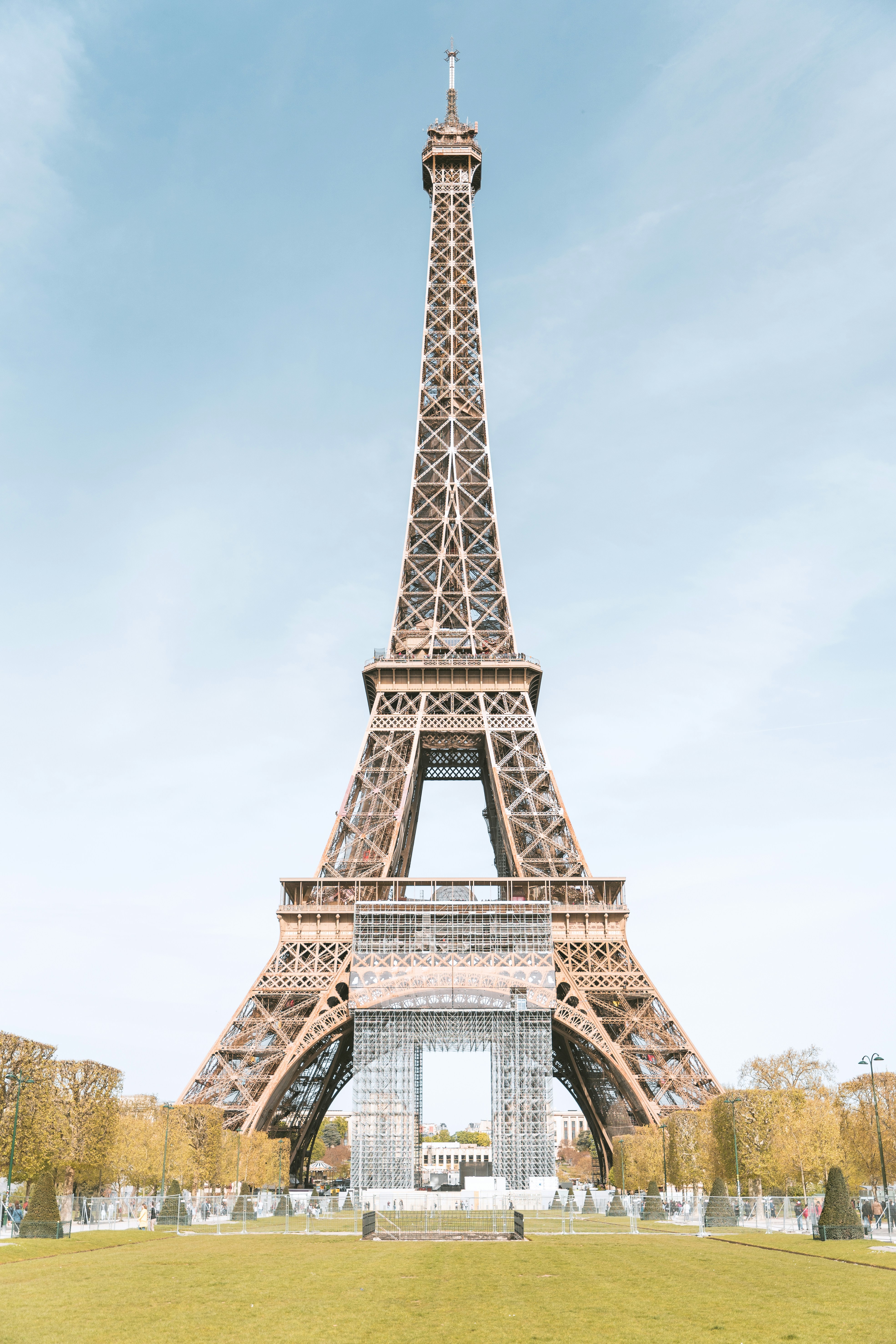 Iron Lace in the Blue: The Eiffel Tower Framed by a Glass Forecourt