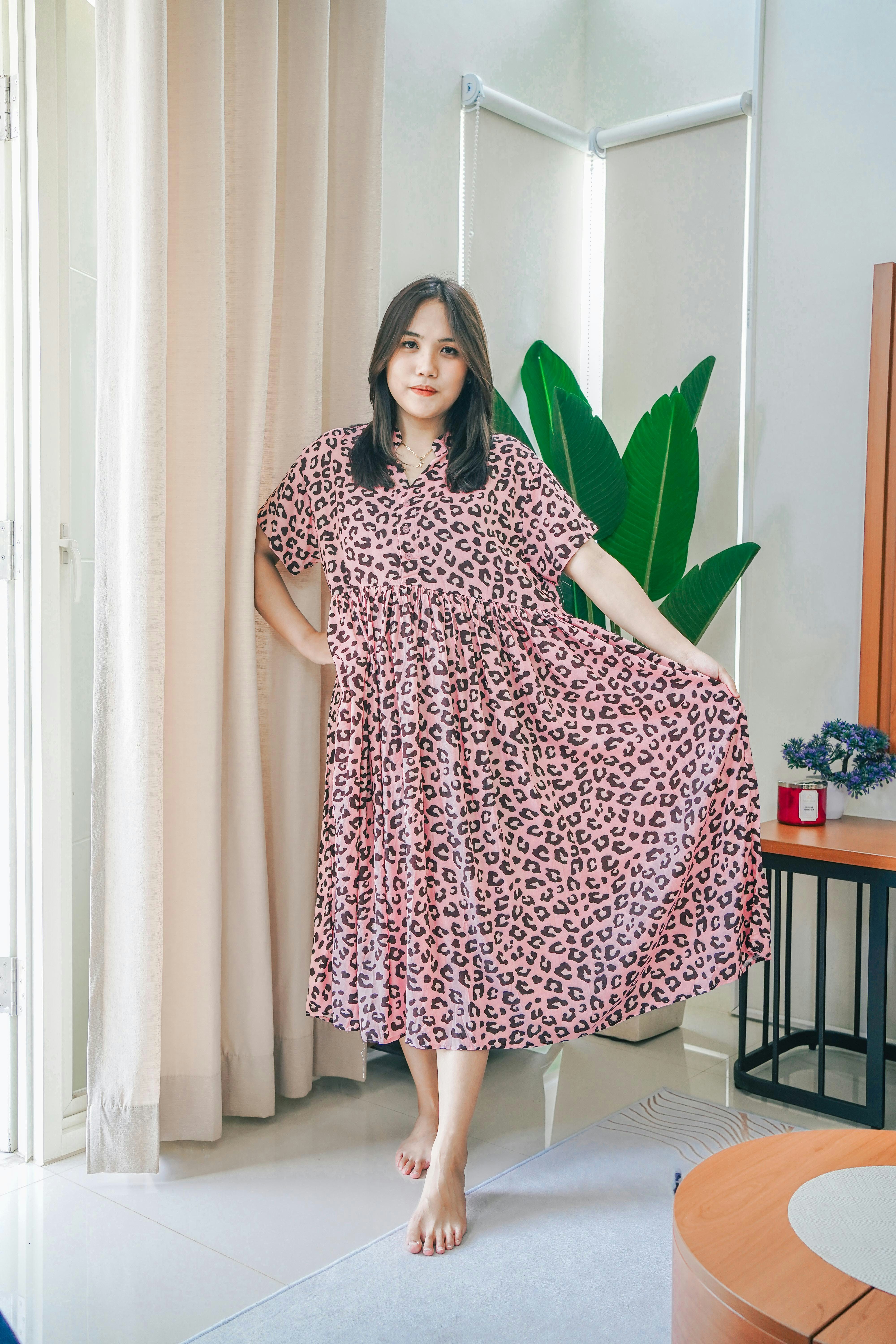 Soft Spotlight: Portrait in a Pink Leopard Dress by a Sunlit Window